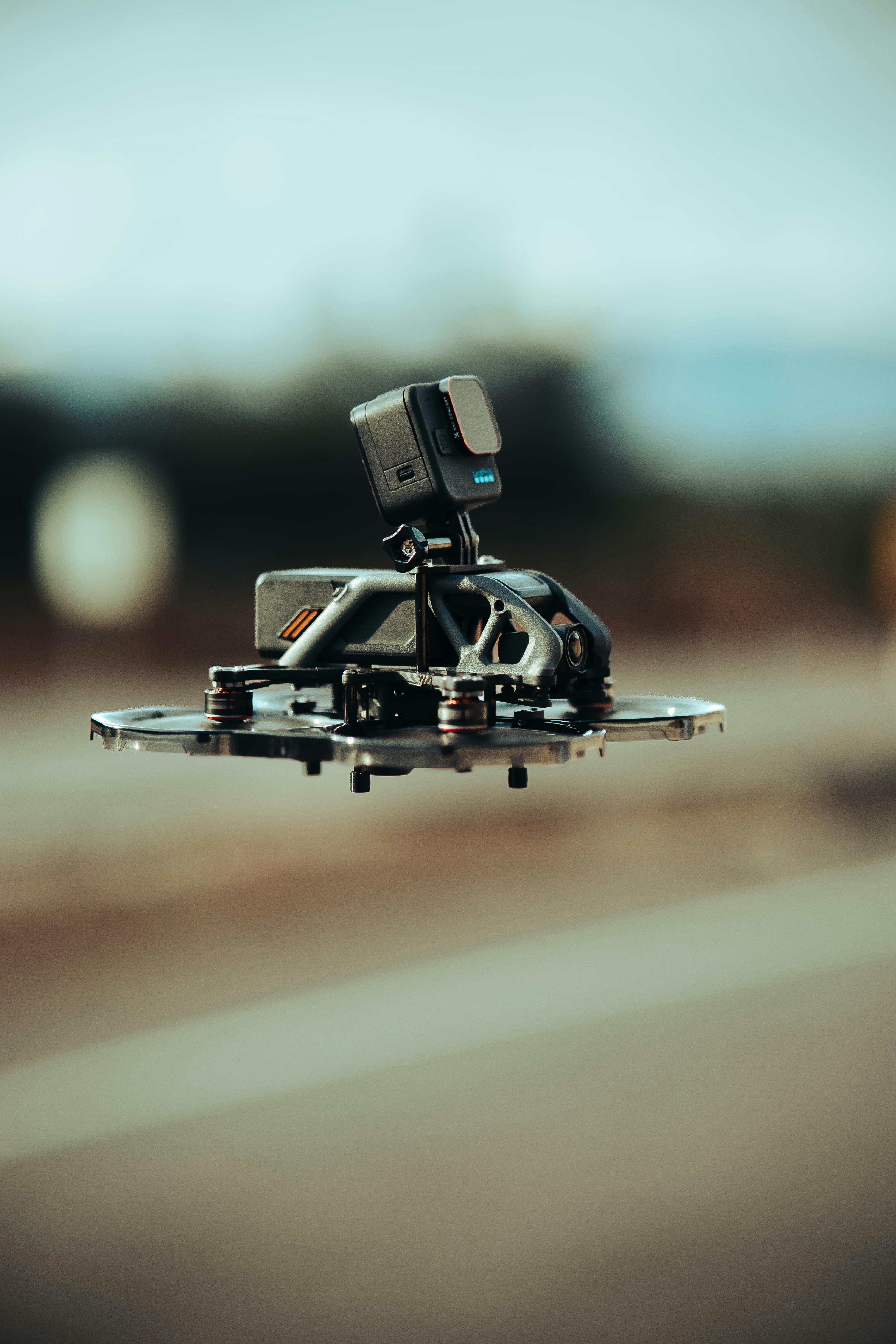 High-Tech Drone with Action Camera in Flight · Free Stock Photo
