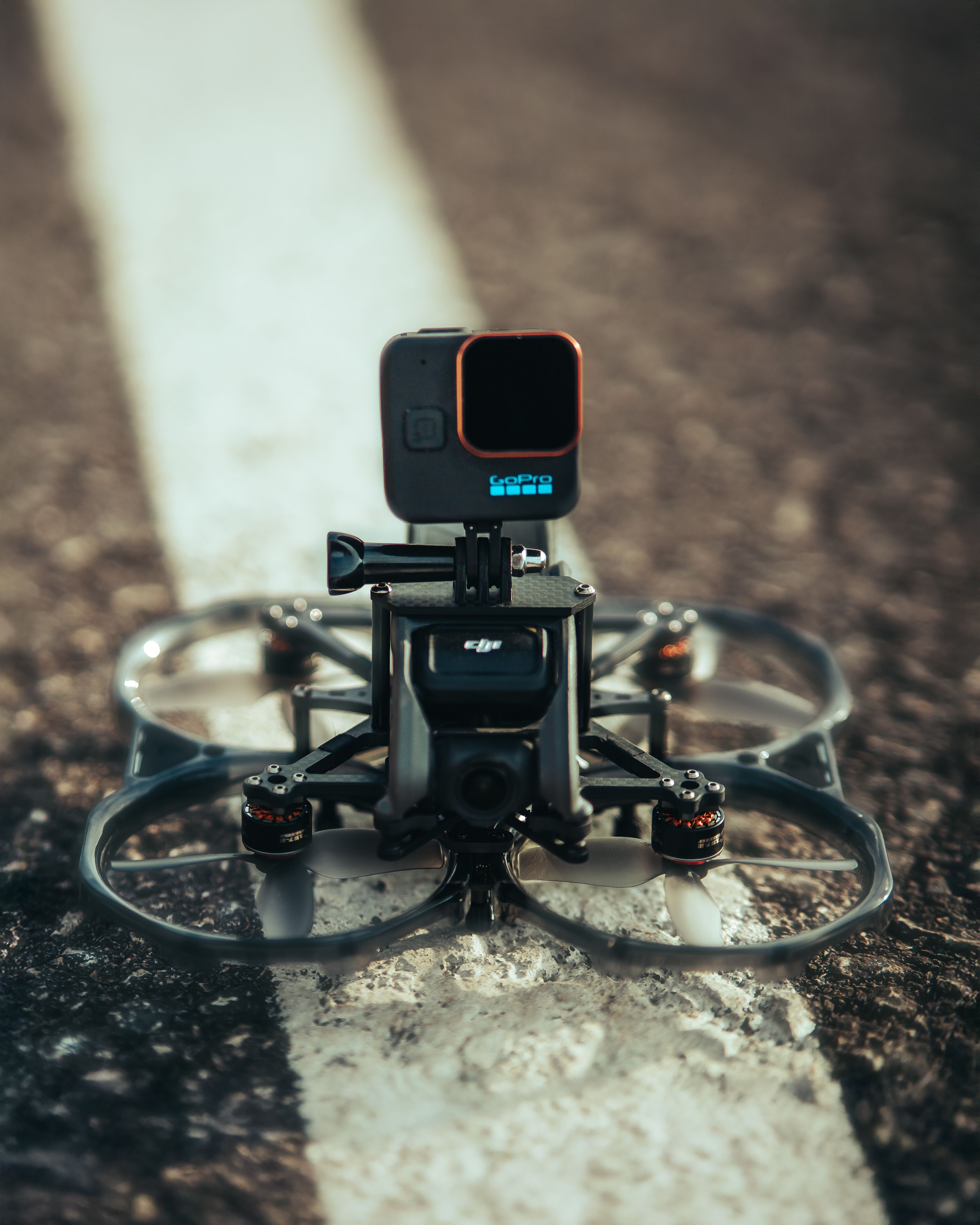 Compact Drone with Mounted Camera on Road · Free Stock Photo