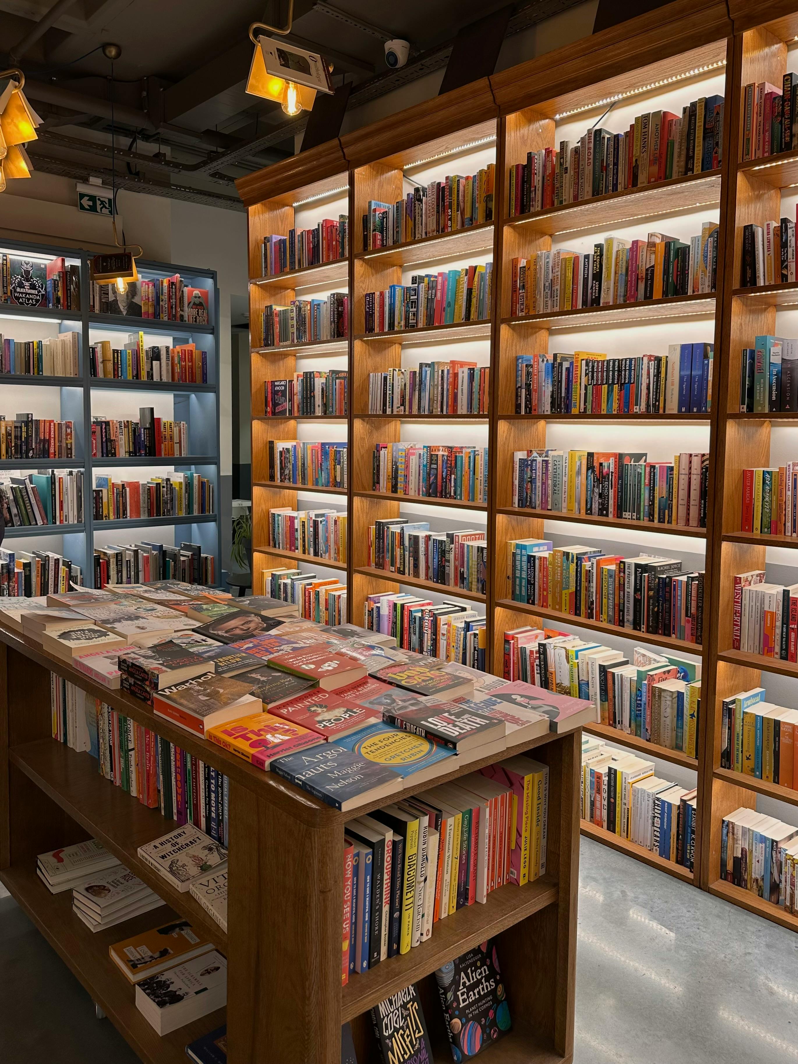 Cozy Bookstore Interior with Wooden Shelves · Free Stock Photo
