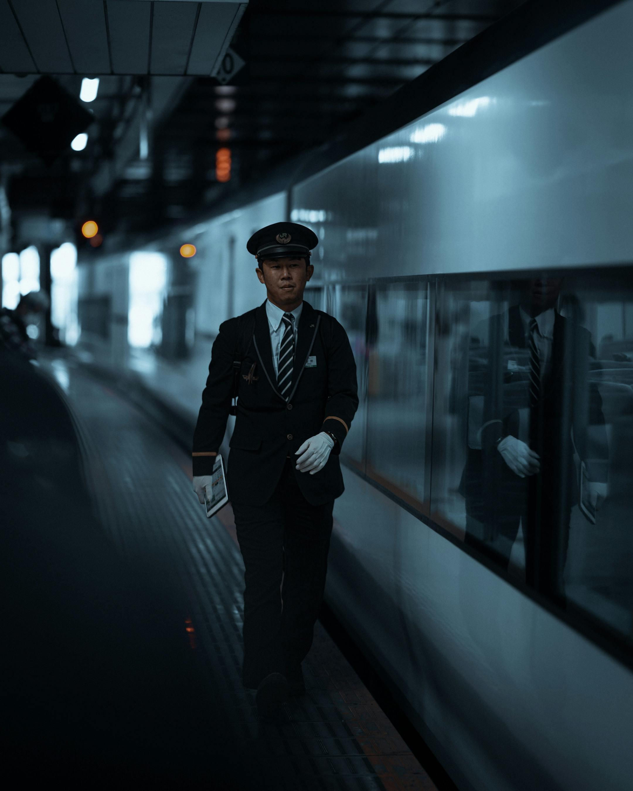 Japanese Train Conductor Walking on Platform · Free Stock Photo