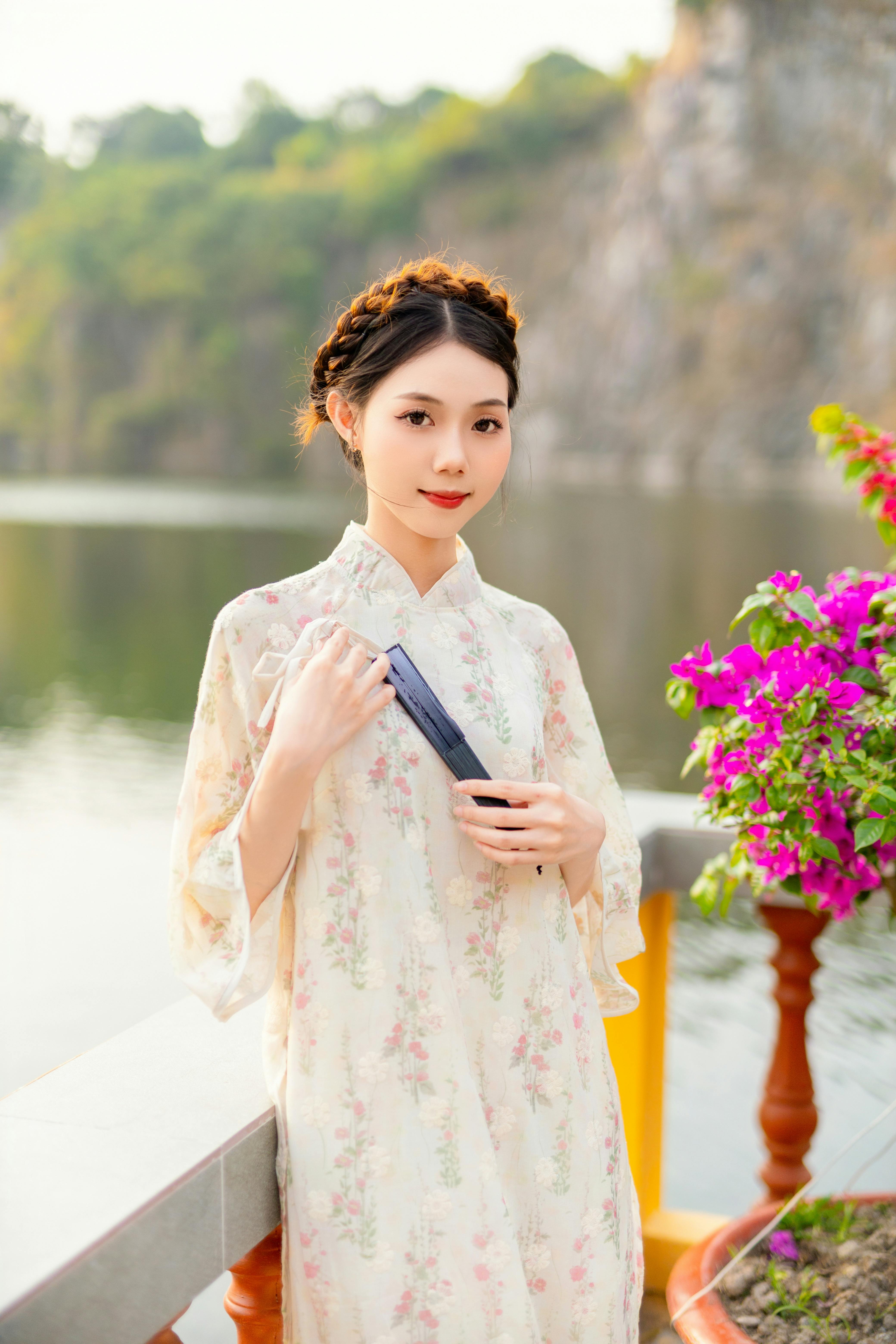 Young Woman in Traditional Dress by Lakeside · Free Stock Photo