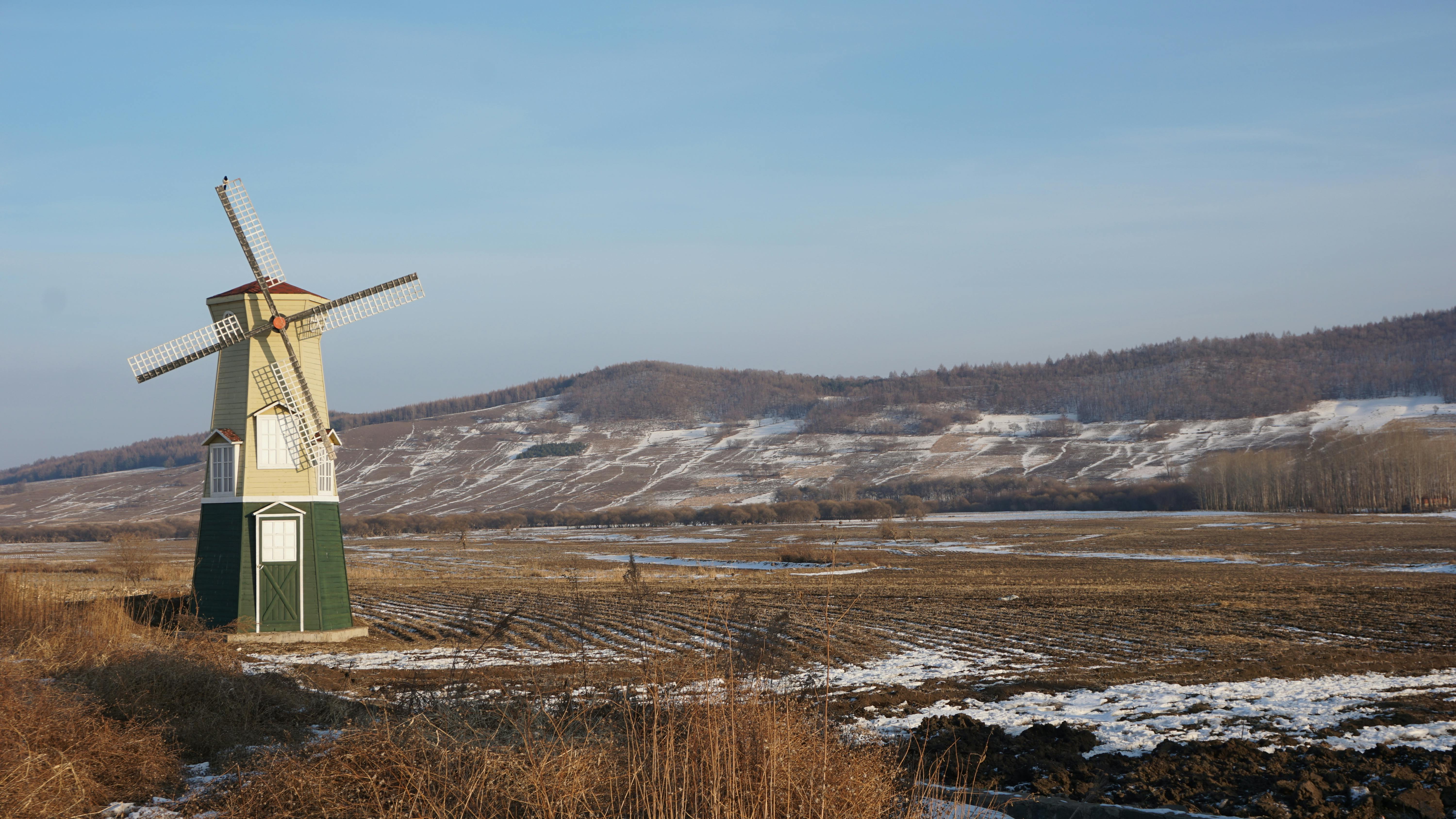 Rustic Windmill in Snowy Landscape · Free Stock Photo