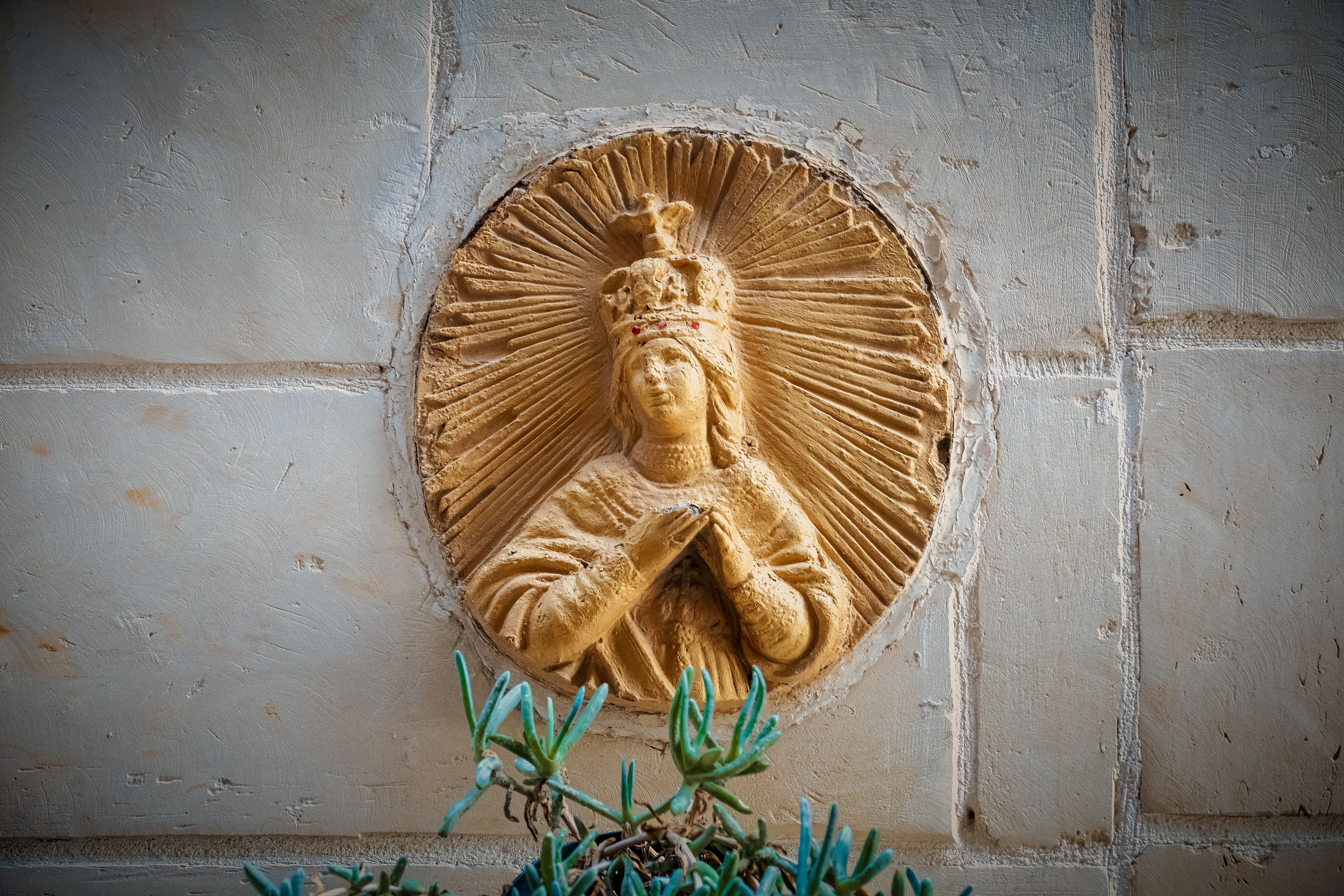 Maltese Relief Sculpture on Historic Stone Wall · Free Stock Photo