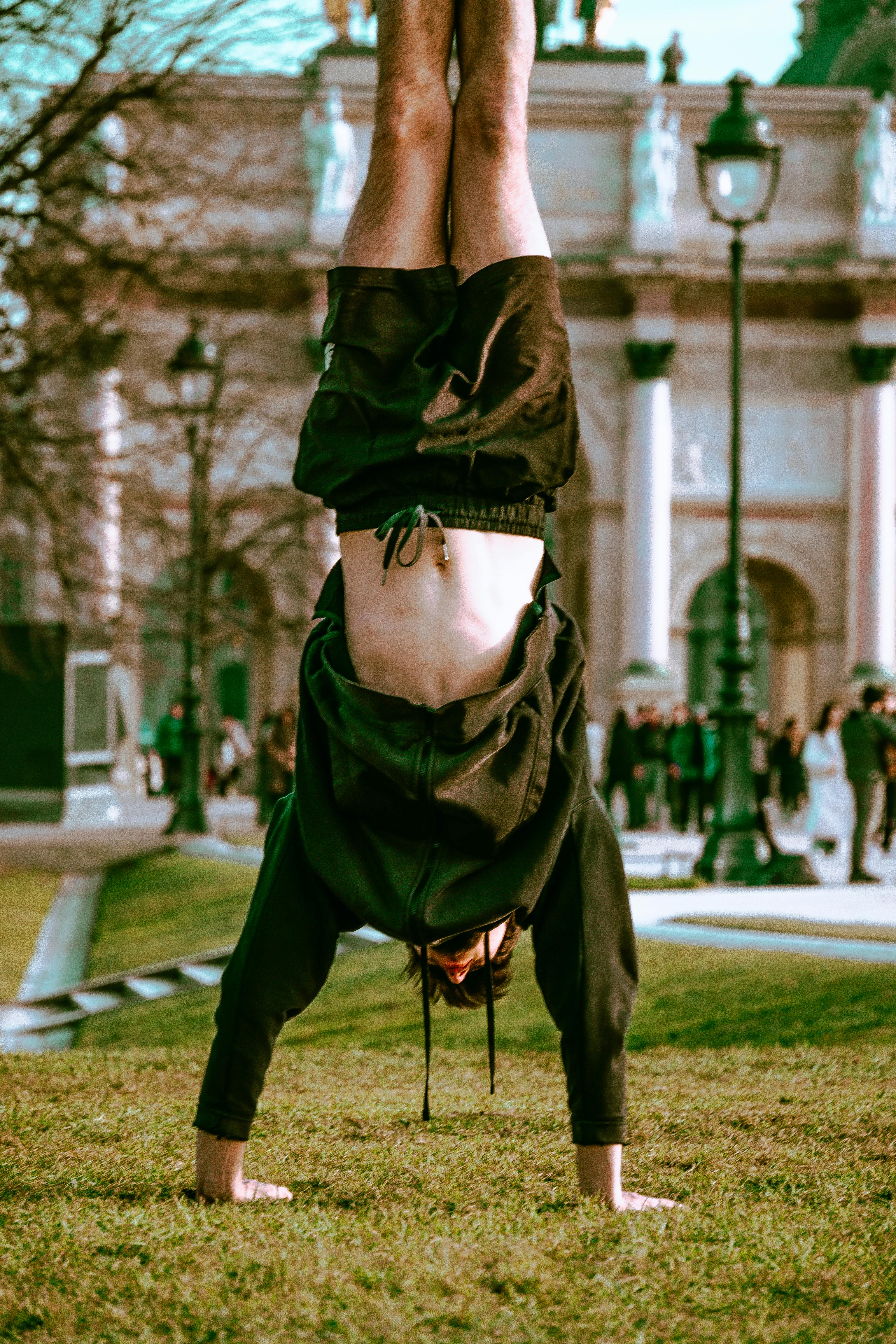 Person Doing Handstand Near Arc de Triomphe in Paris · Free Stock Photo