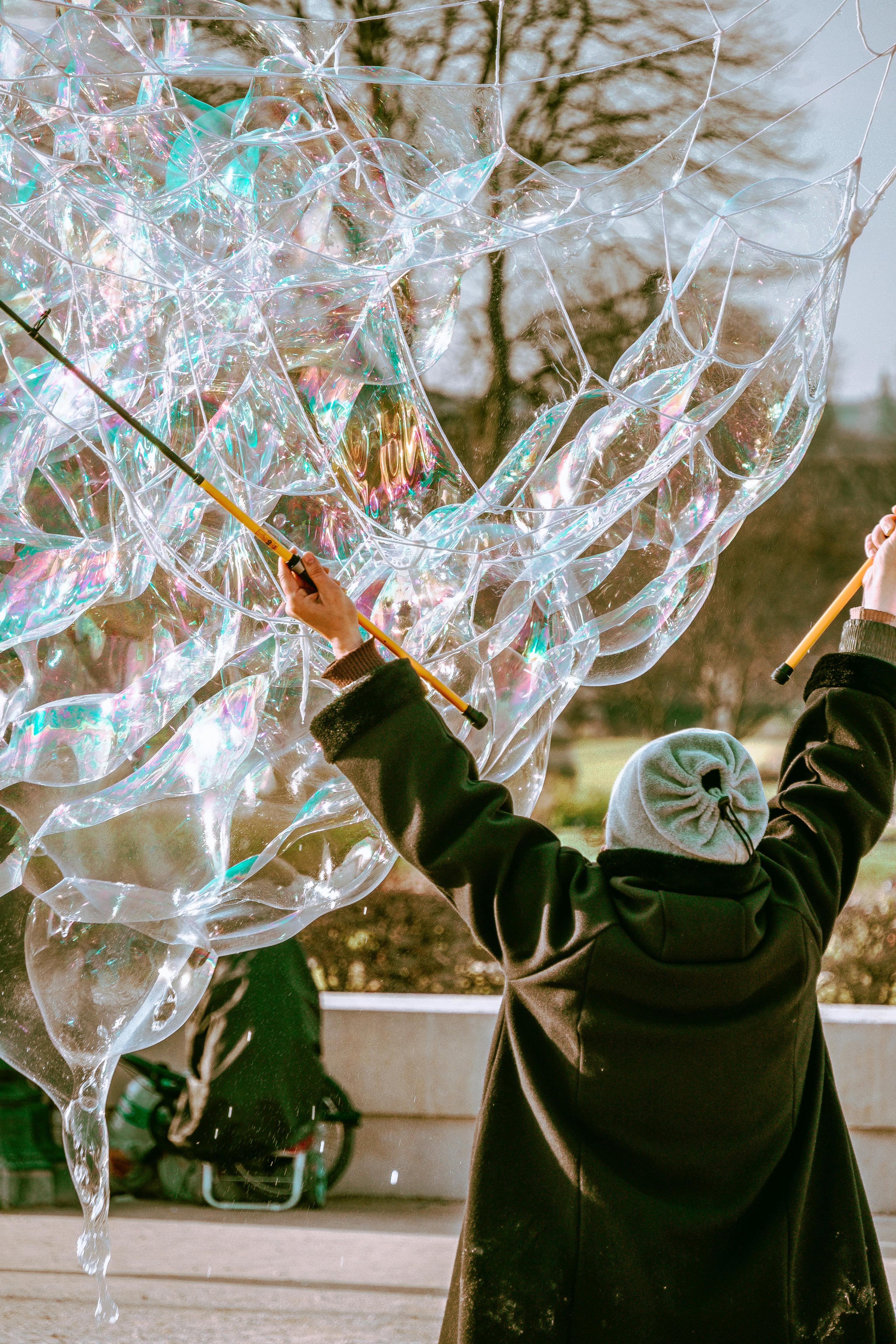 Joyful Bubble Performance in Paris Park · Free Stock Photo