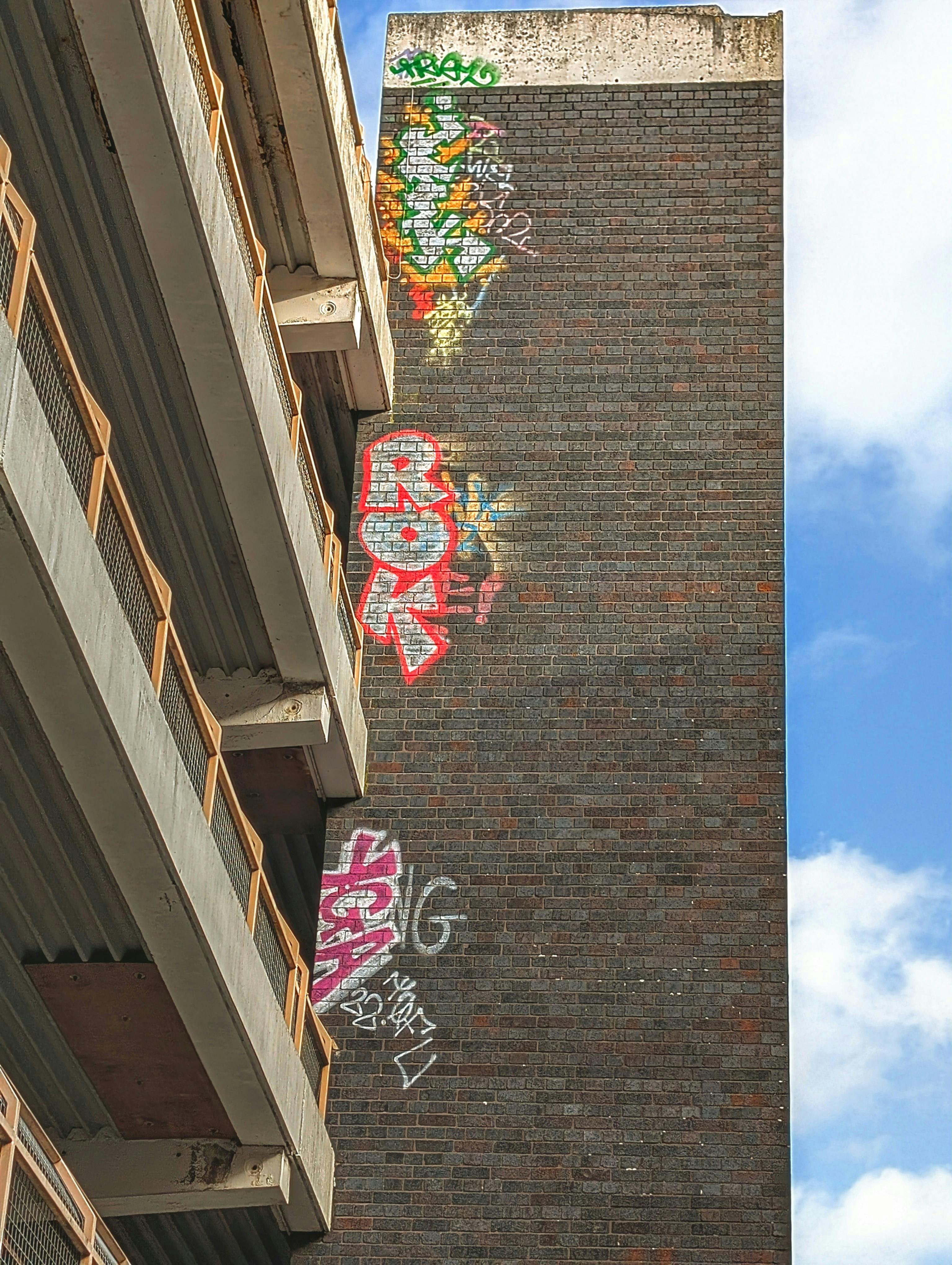 Urban Graffiti on High-Rise Building Exterior · Free Stock Photo