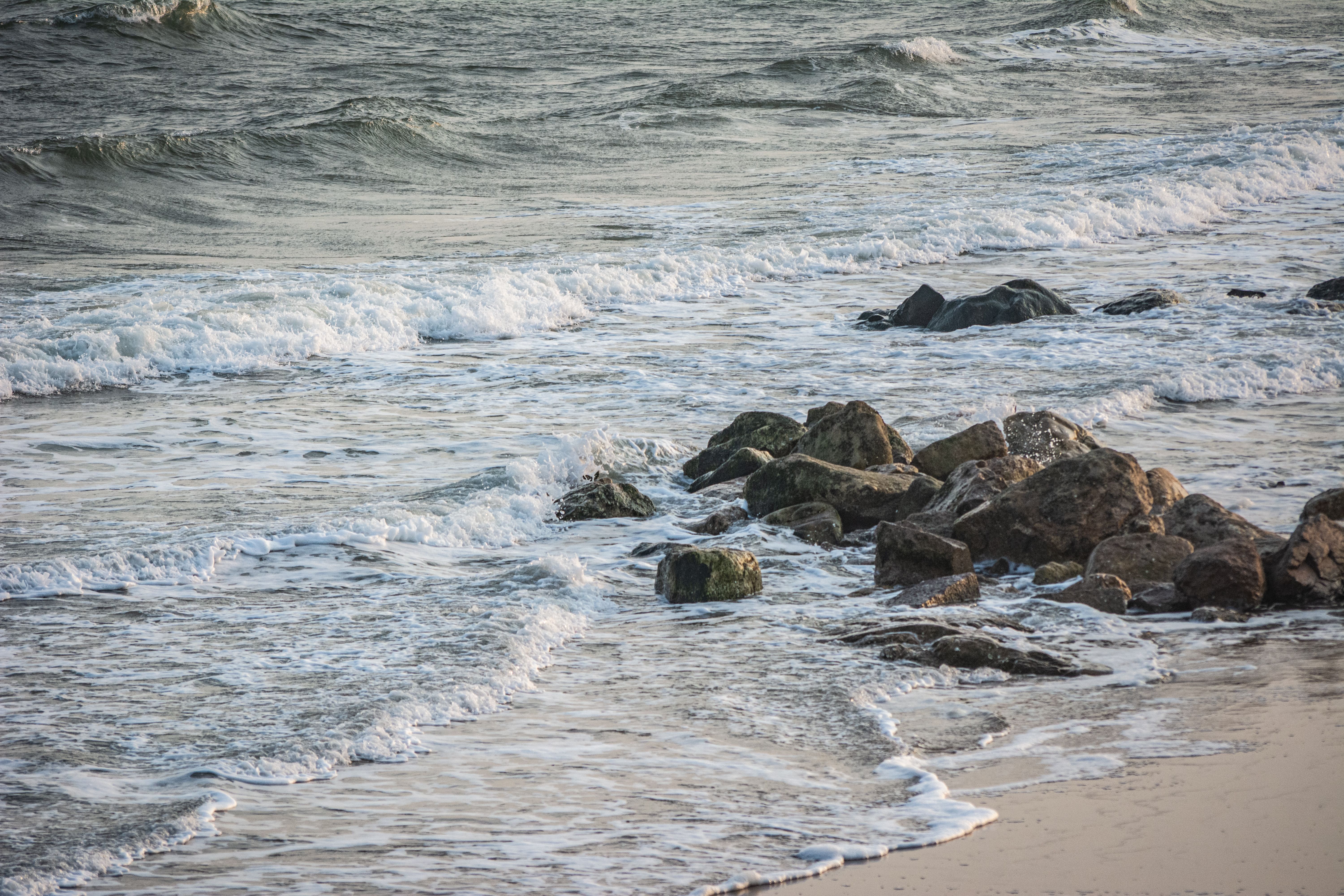 Rocky Shoreline with Gentle Ocean Waves · Free Stock Photo