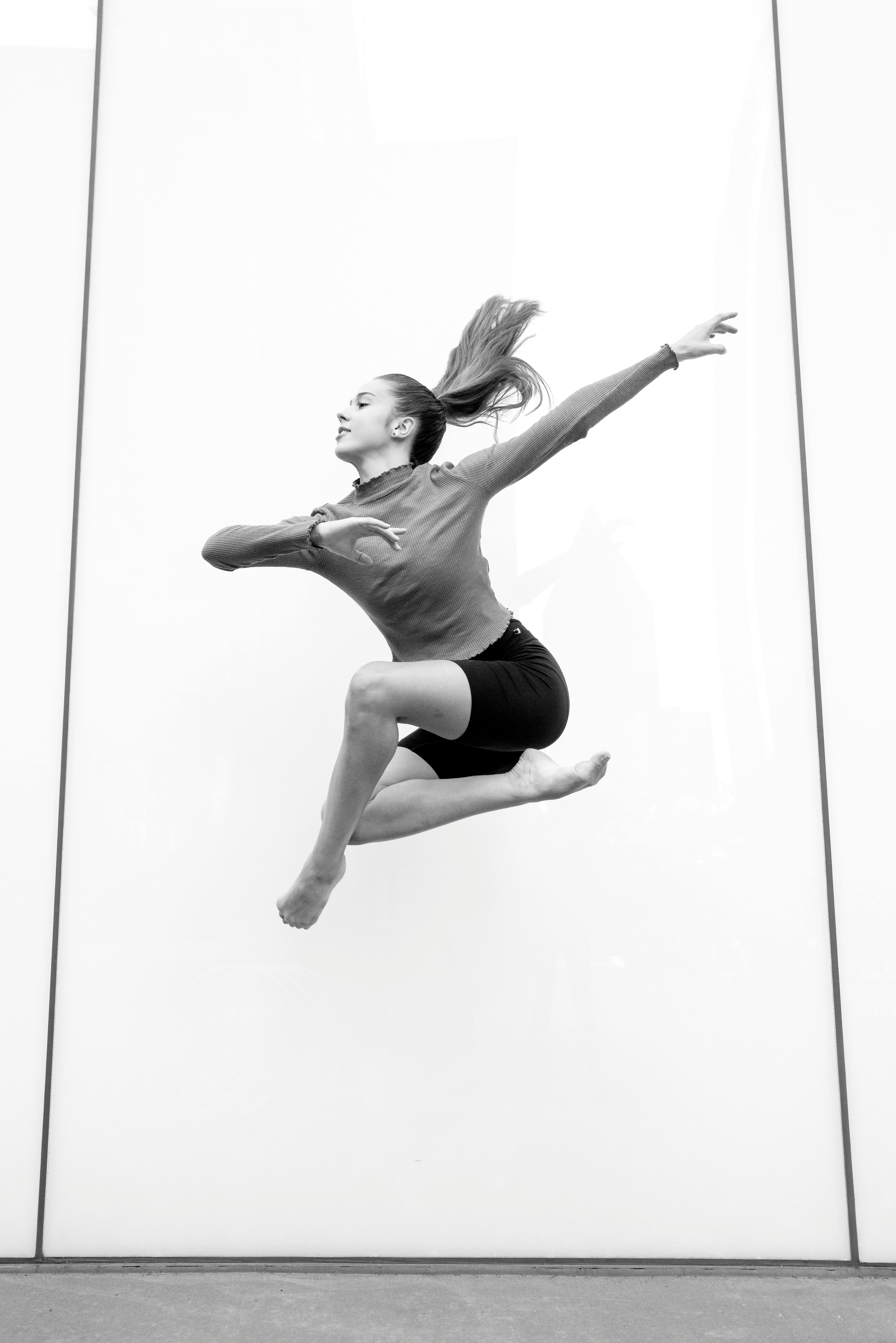 Dynamic Leap Black and White Dance Portrait · Free Stock Photo