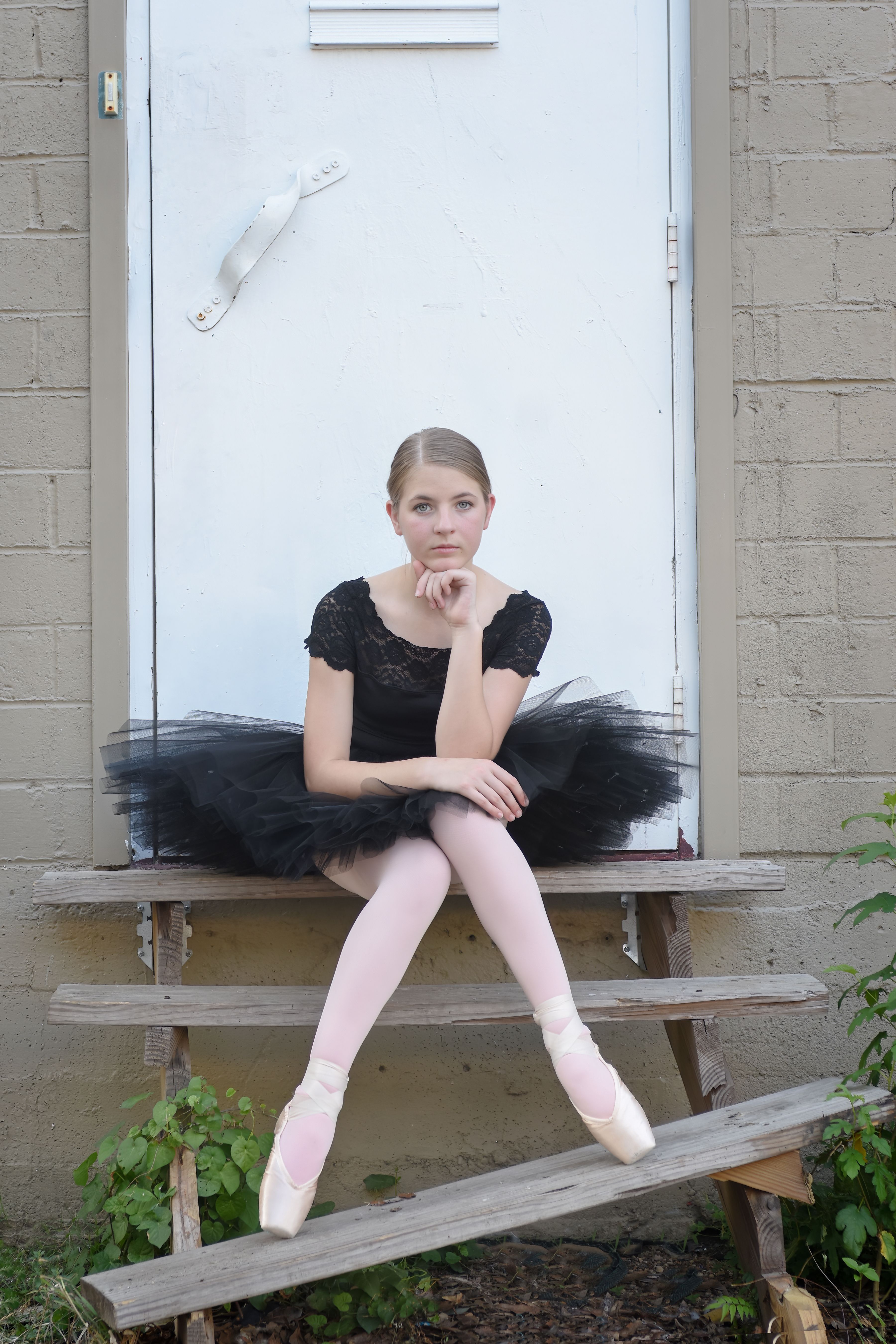 Ballet Dancer Posing Outdoors on Wooden Steps · Free Stock Photo