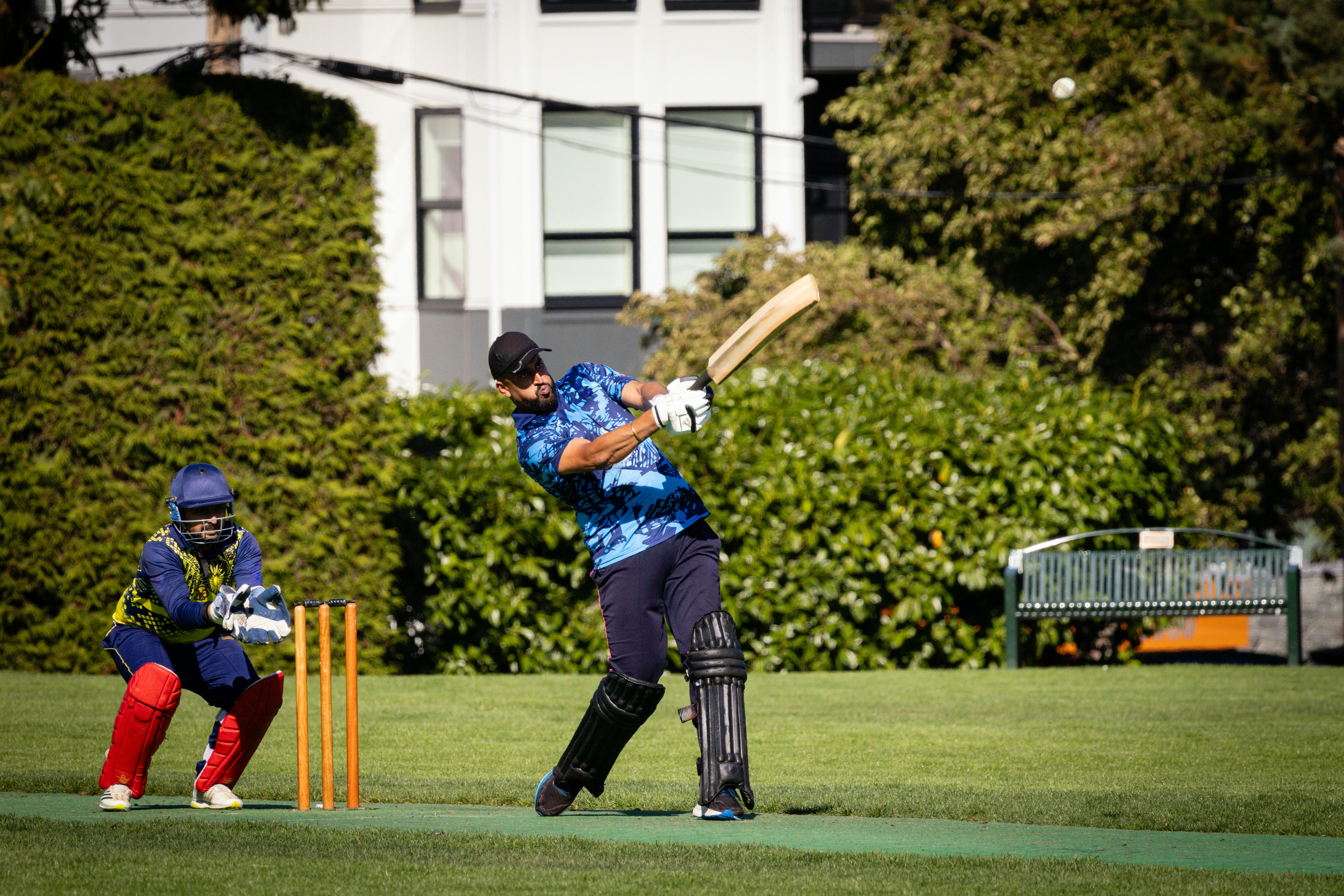 Low Angle Shot of Man Playing Cricket · Free Stock Photo