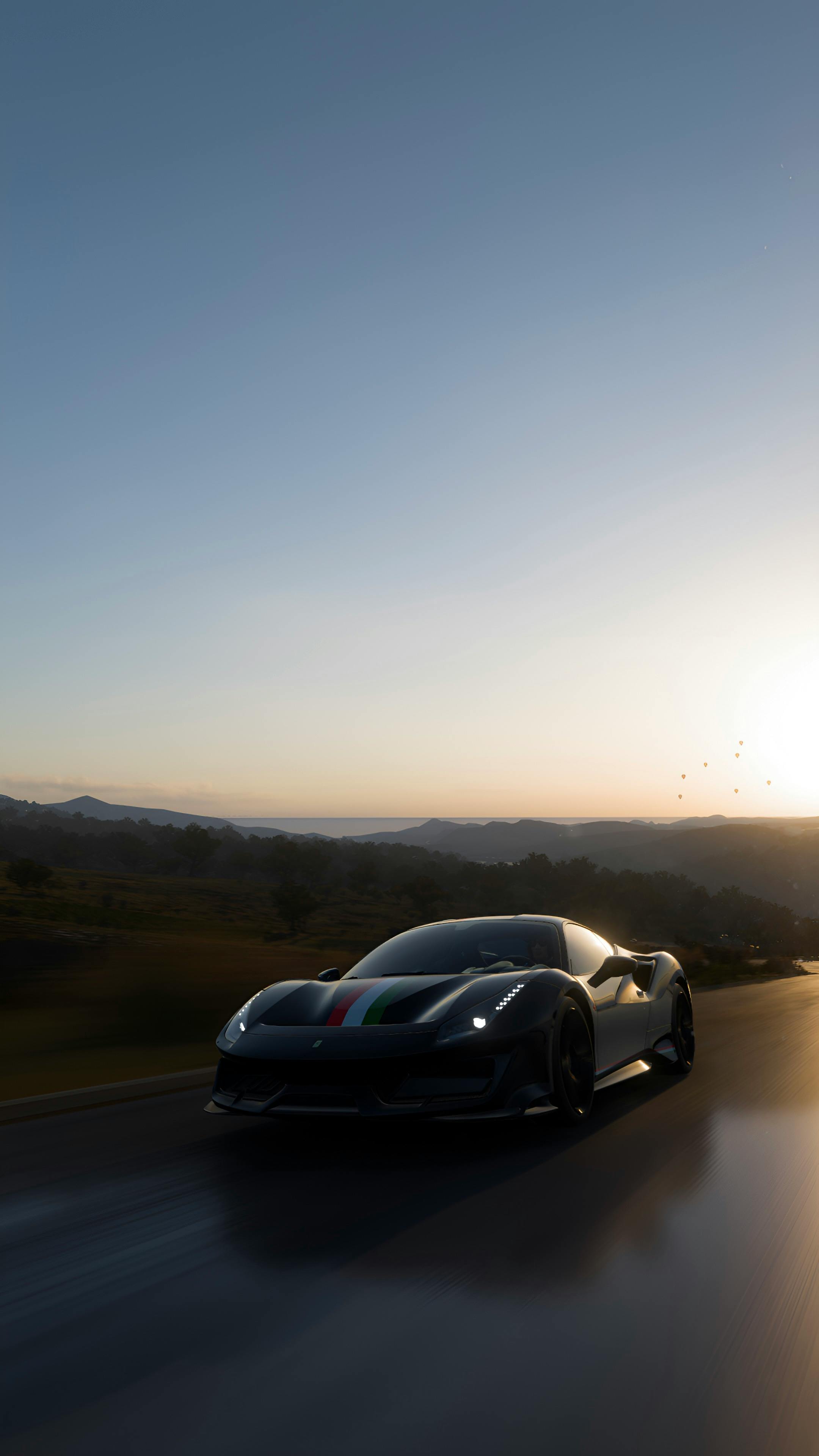 High-Speed Luxury Sports Car on Open Road at Sunset · Free Stock Photo