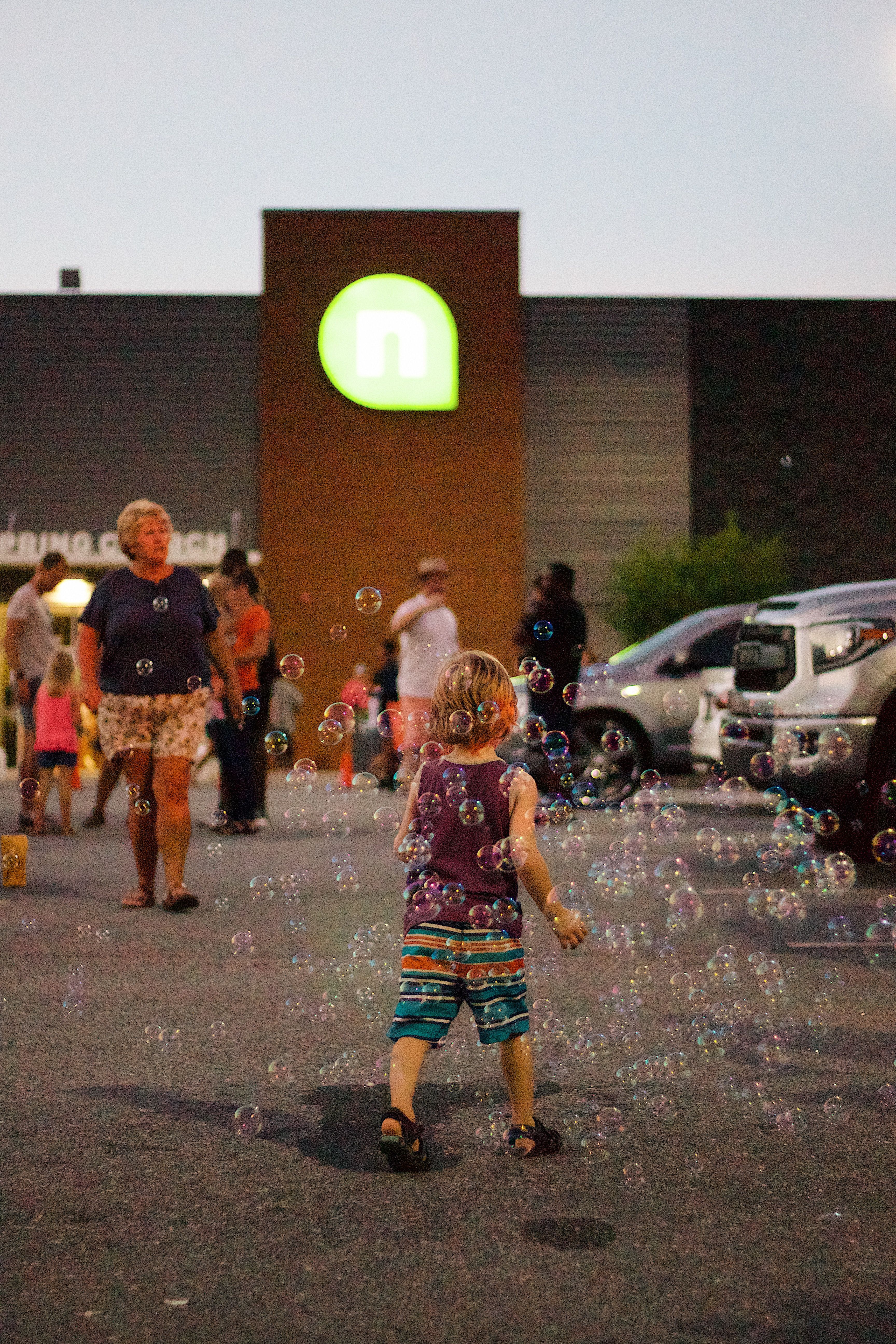 Vibrant Community Gathering with Bubbles · Free Stock Photo