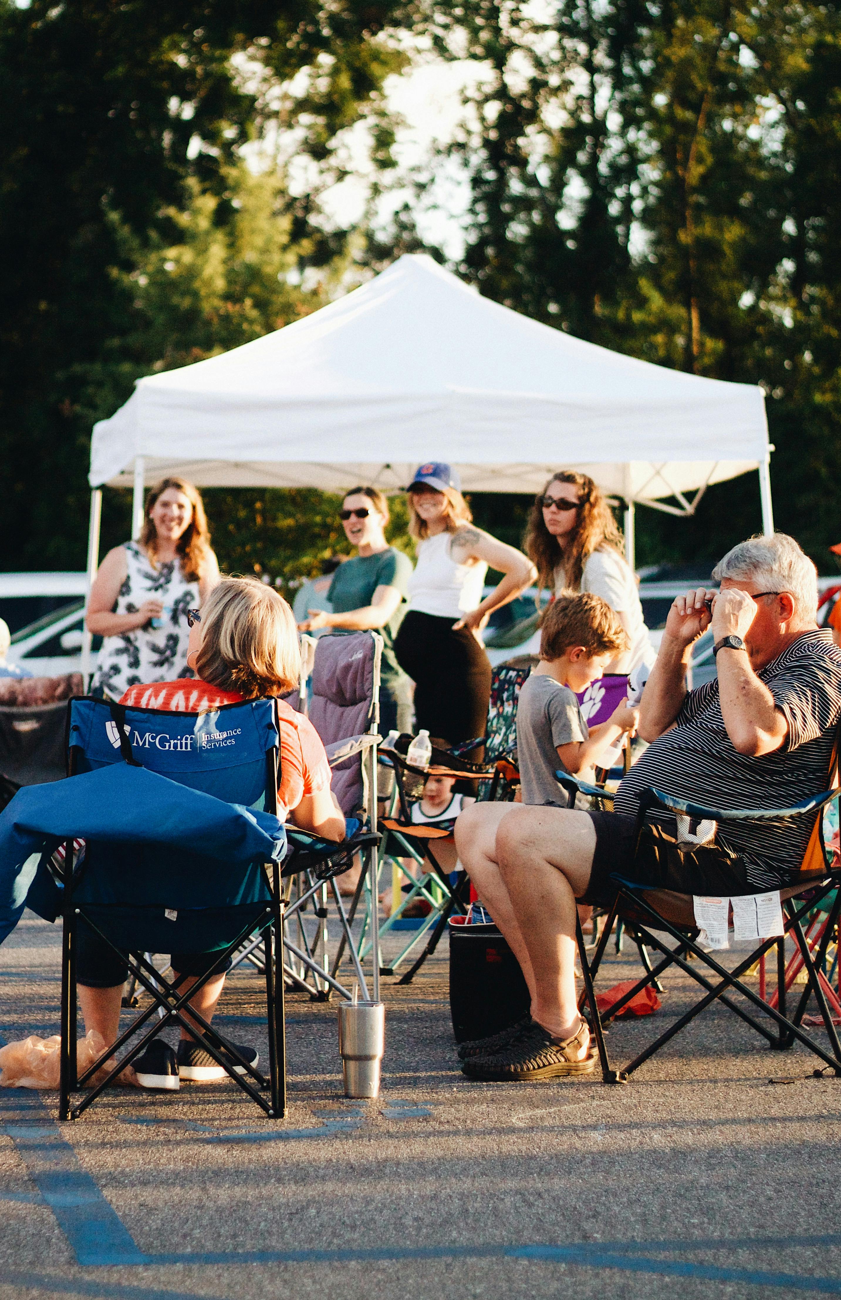 Community Gathering with Outdoor Seating and Tent · Free Stock Photo