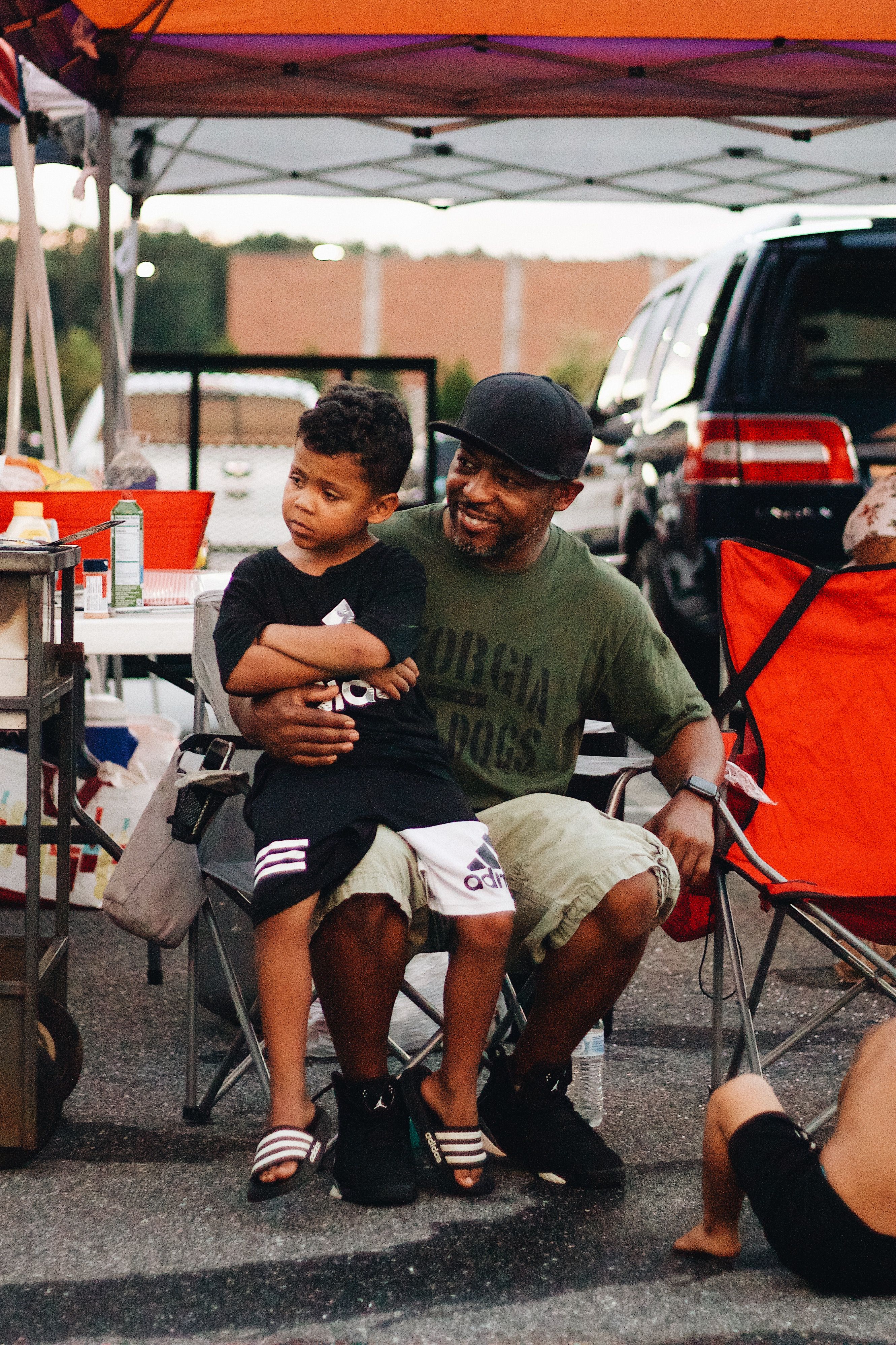Family Enjoying Community Event Outdoors · Free Stock Photo