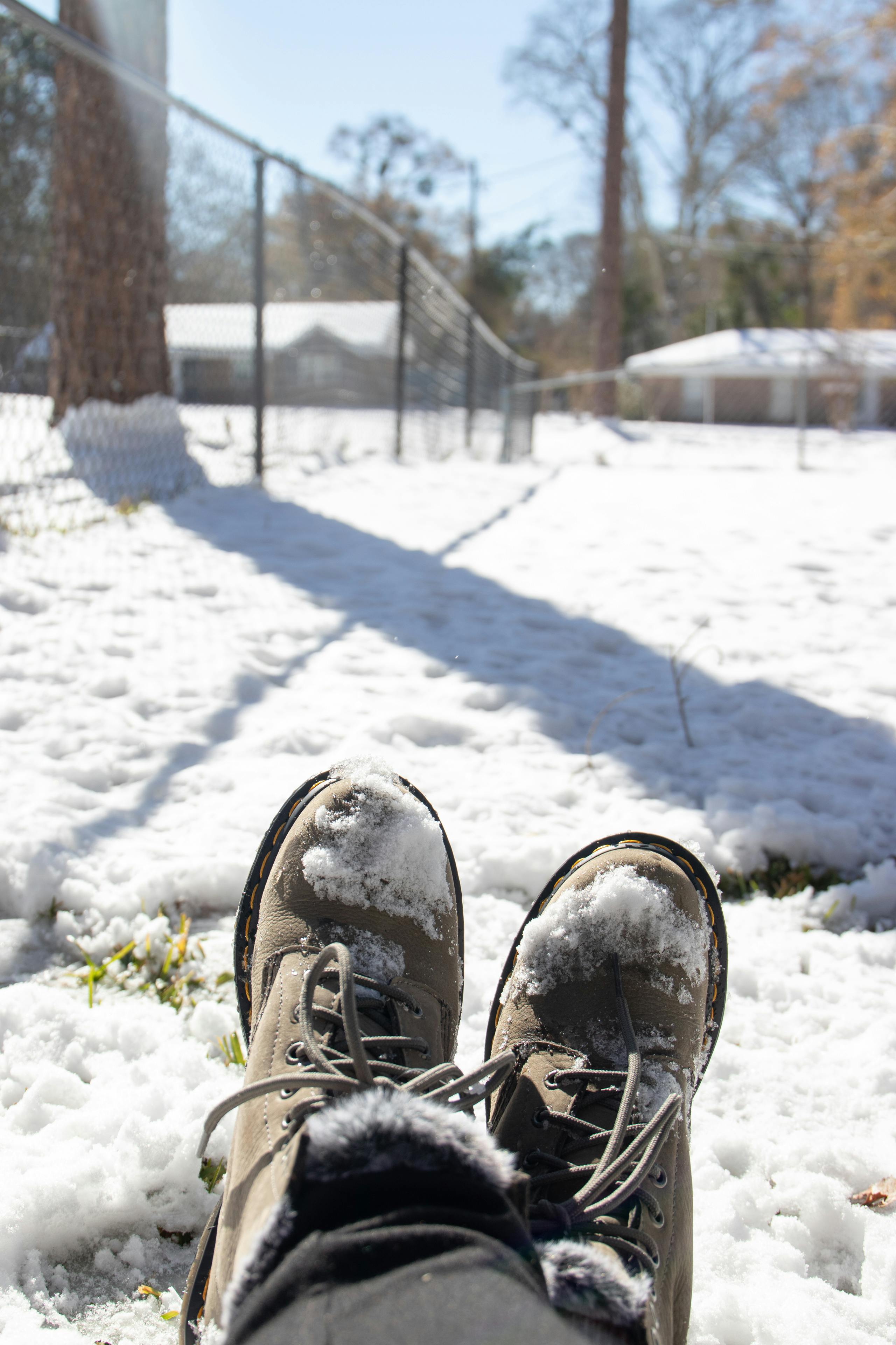 Snow-Capped Boots in Alabama Winter Scene · Free Stock Photo