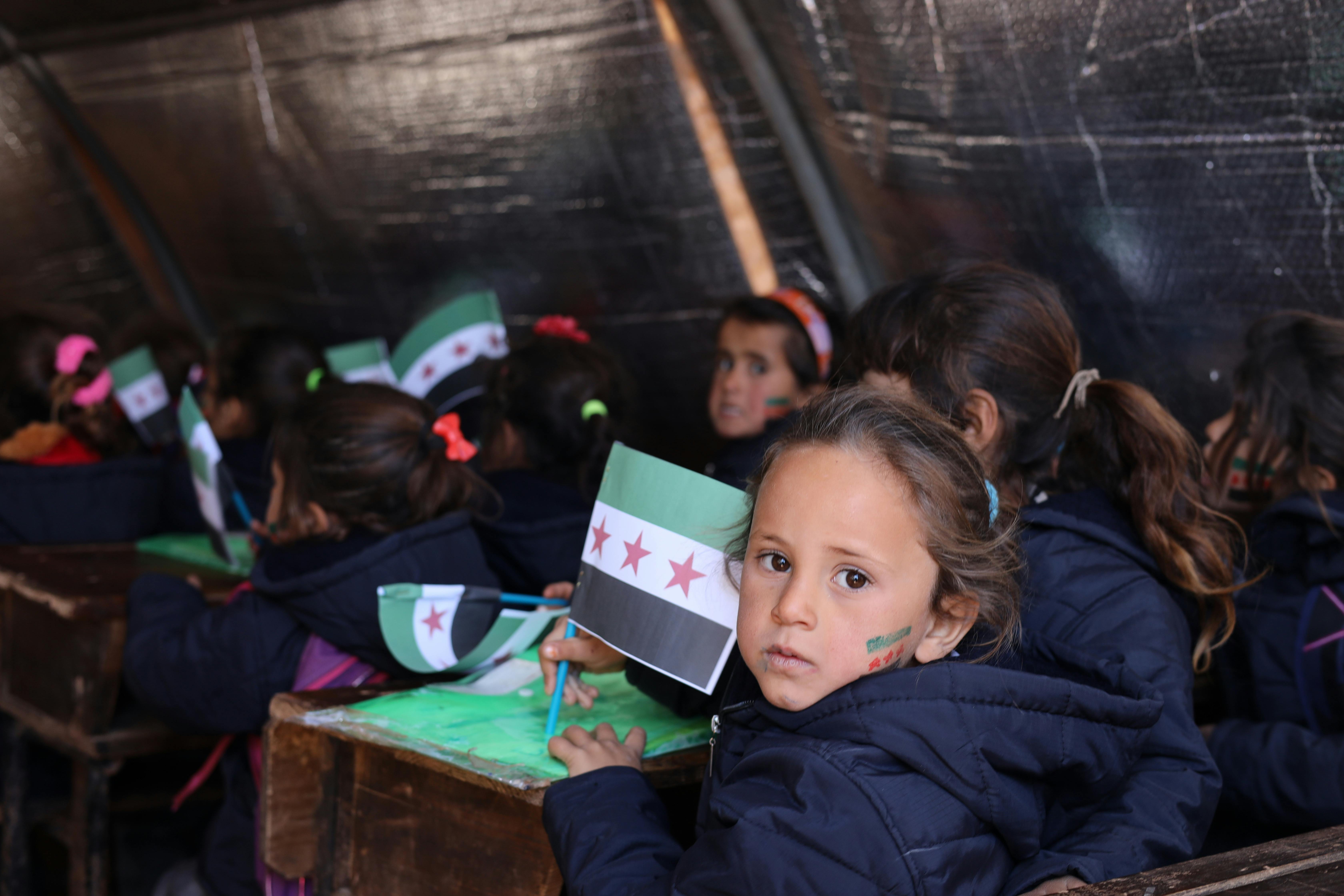 Syrian Children in Classroom with Flags · Free Stock Photo