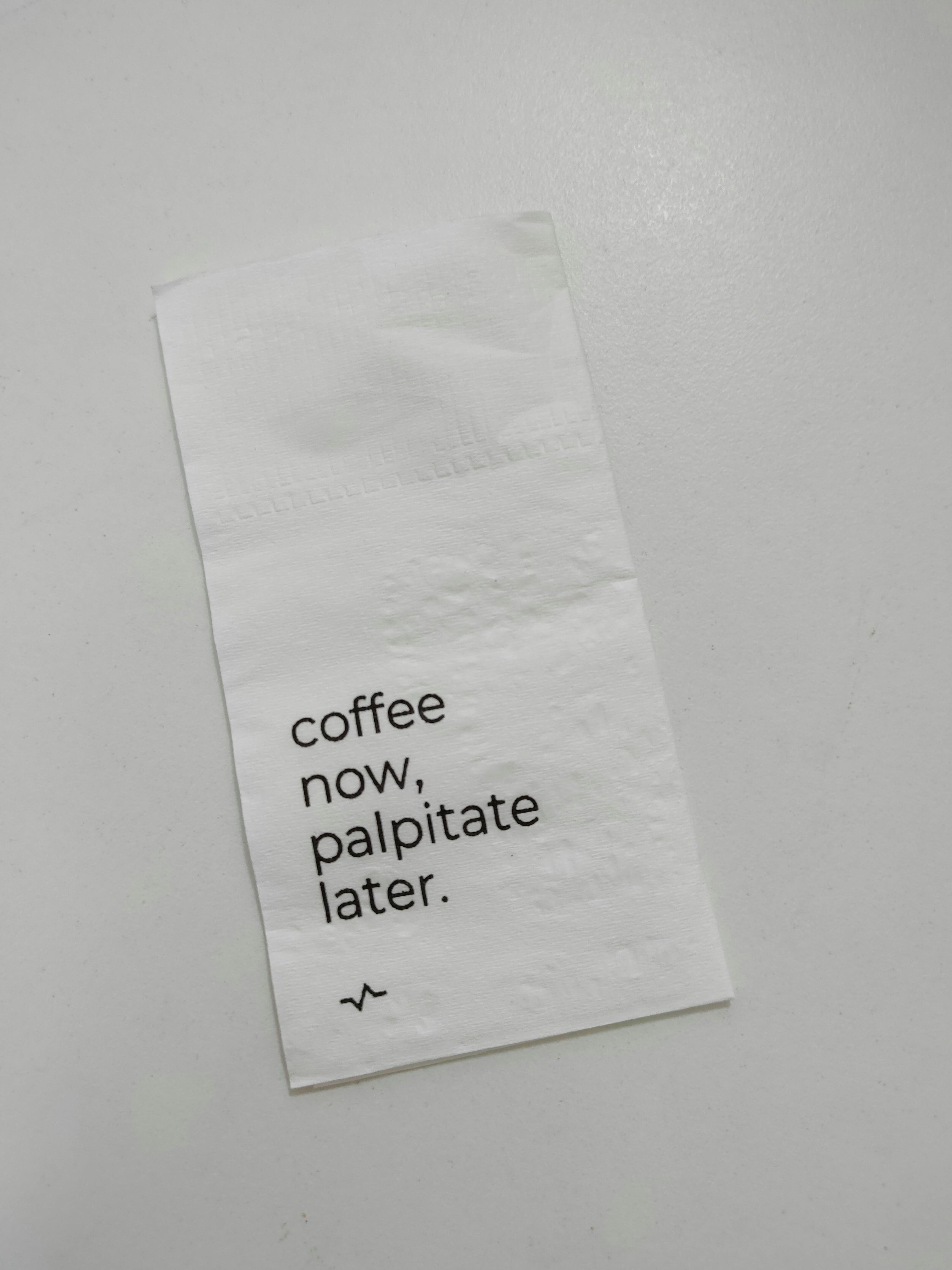 Quirky Coffee Message on White Napkin · Free Stock Photo