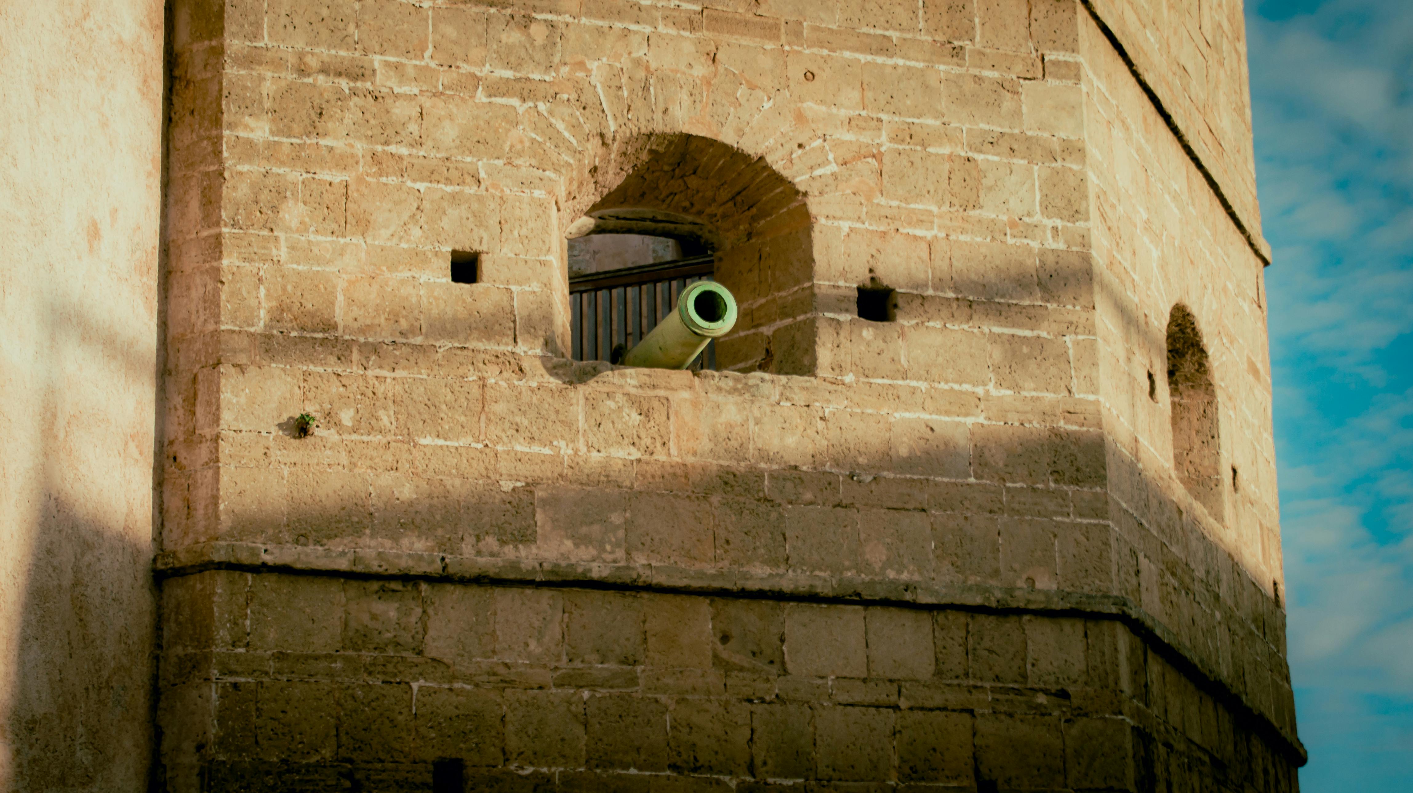 Historic Cannon in Moroccan Stone Fort Wall · Free Stock Photo