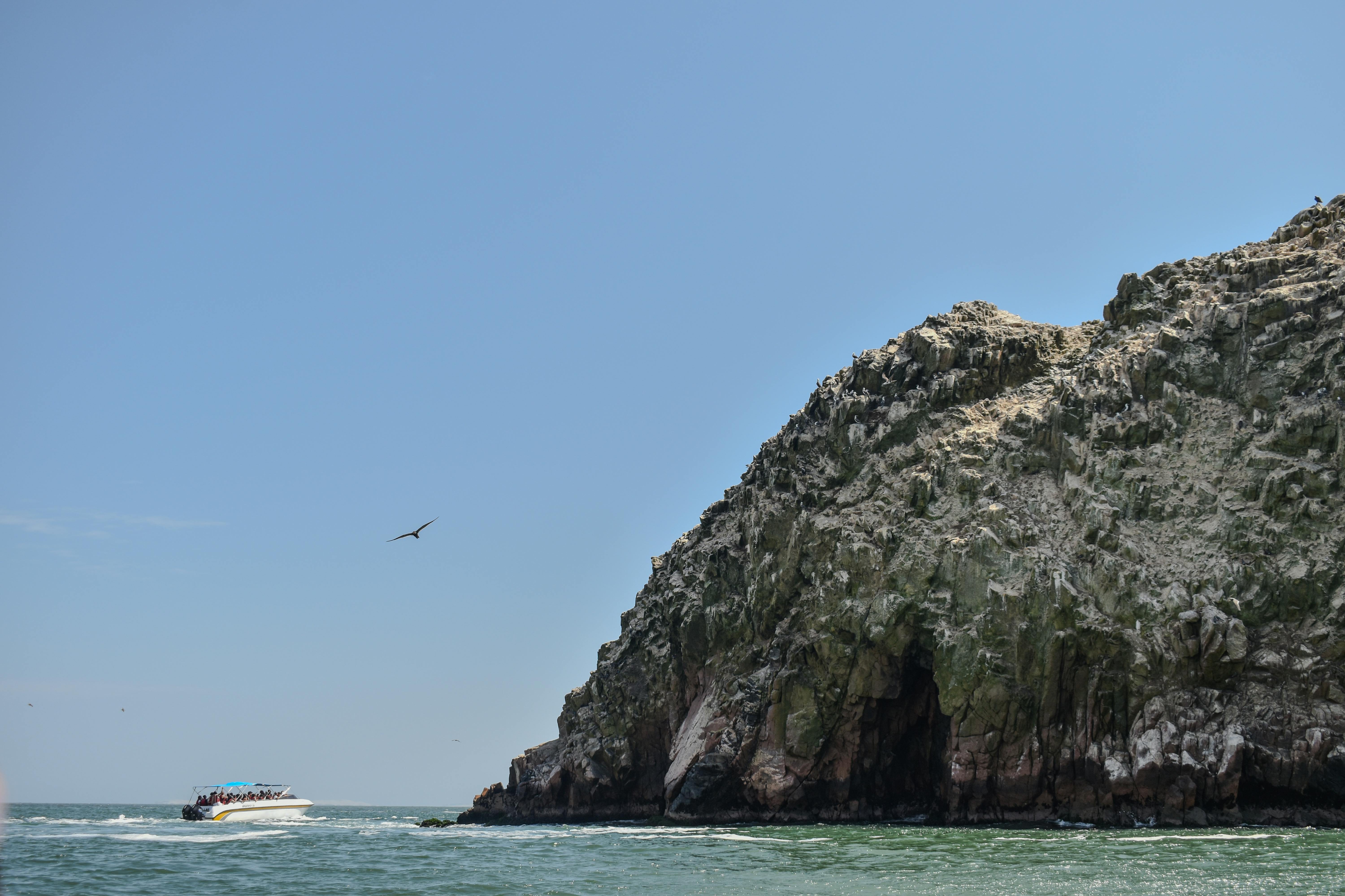 Scenic Boat Ride Near Rocky Cliff in Paracas · Free Stock Photo
