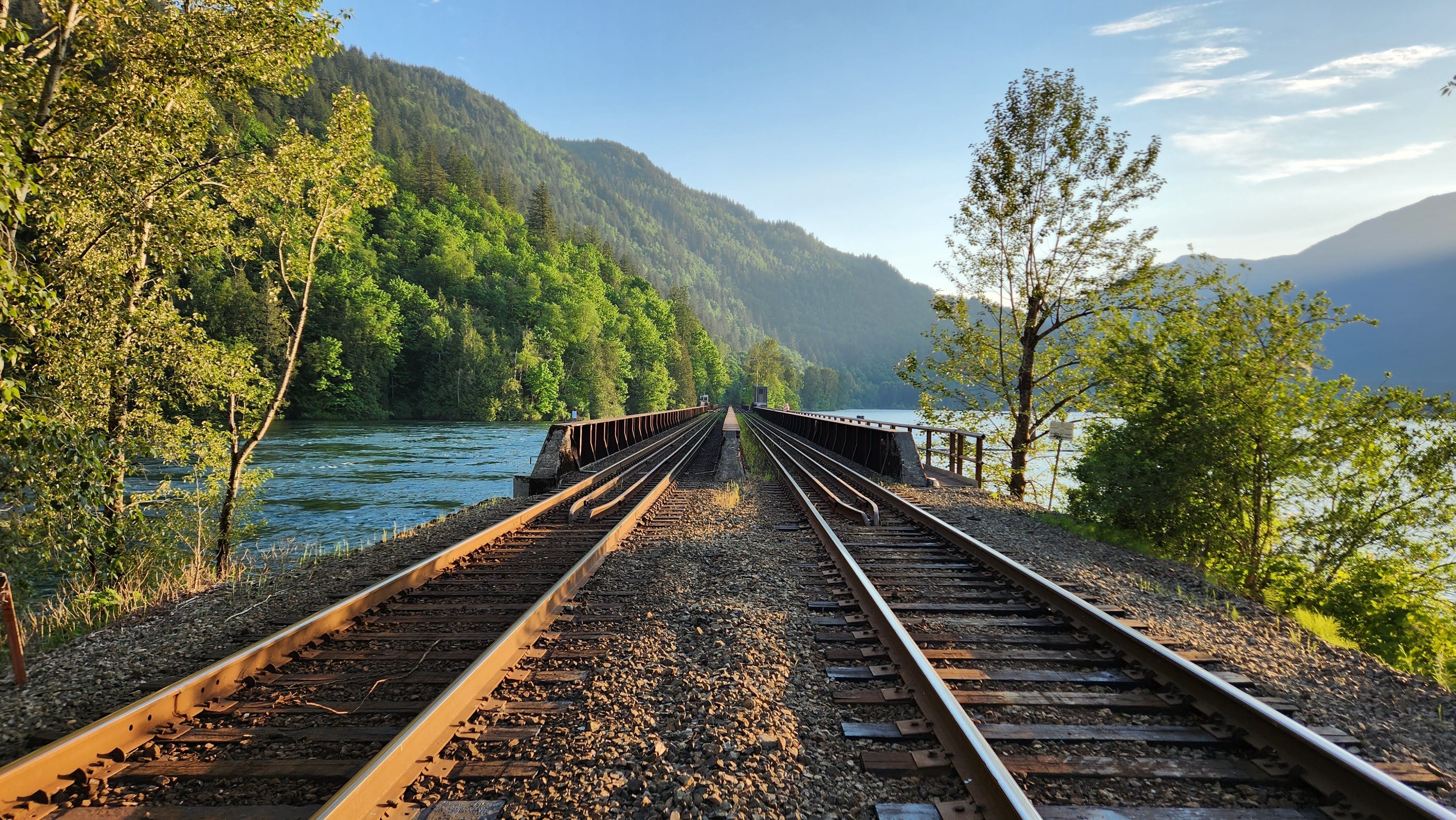 Railroad Tracks Over River in Stunning Mountain Landscape · Free Stock ...