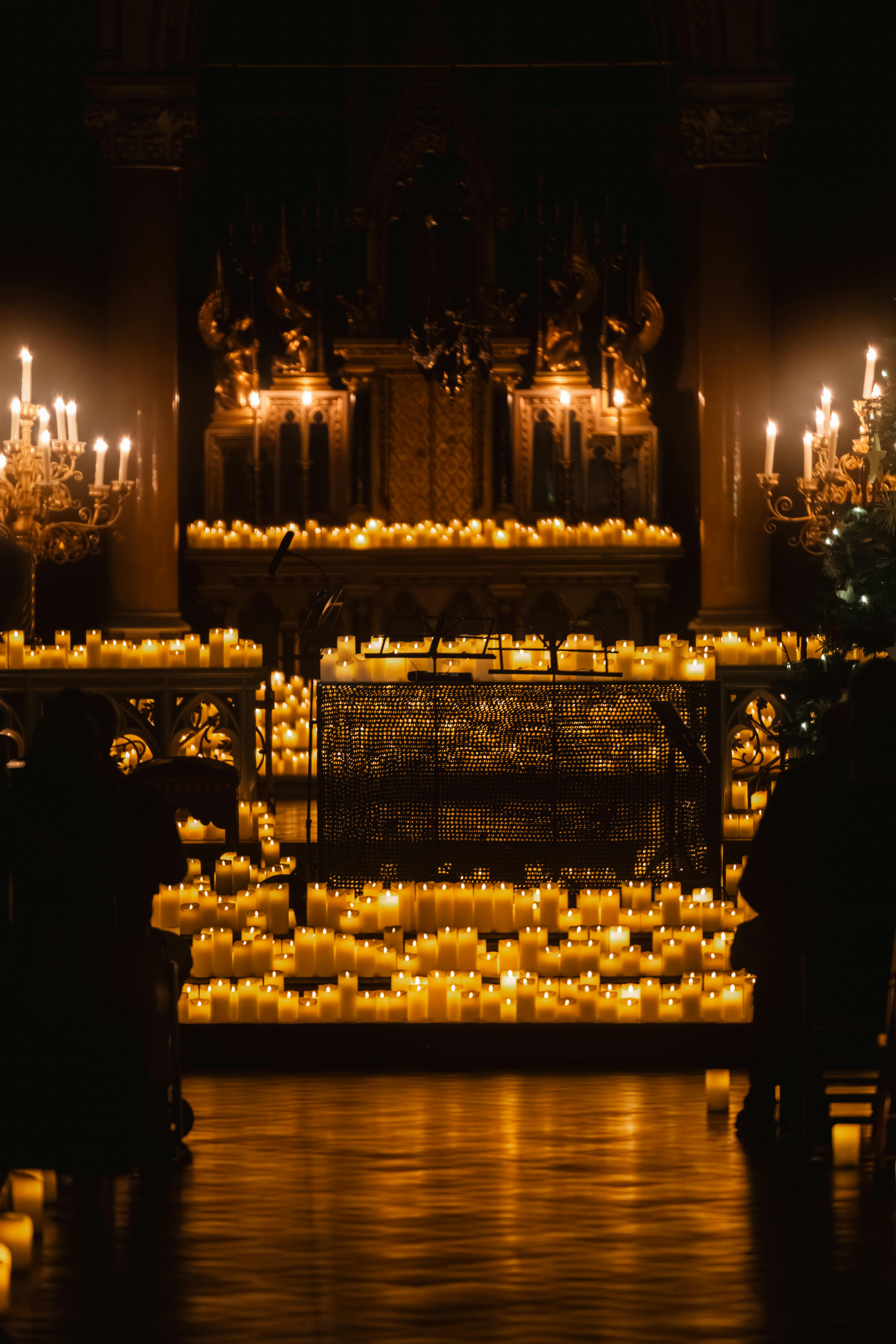 Candlelit Church Interior with Warm Ambiance · Free Stock Photo