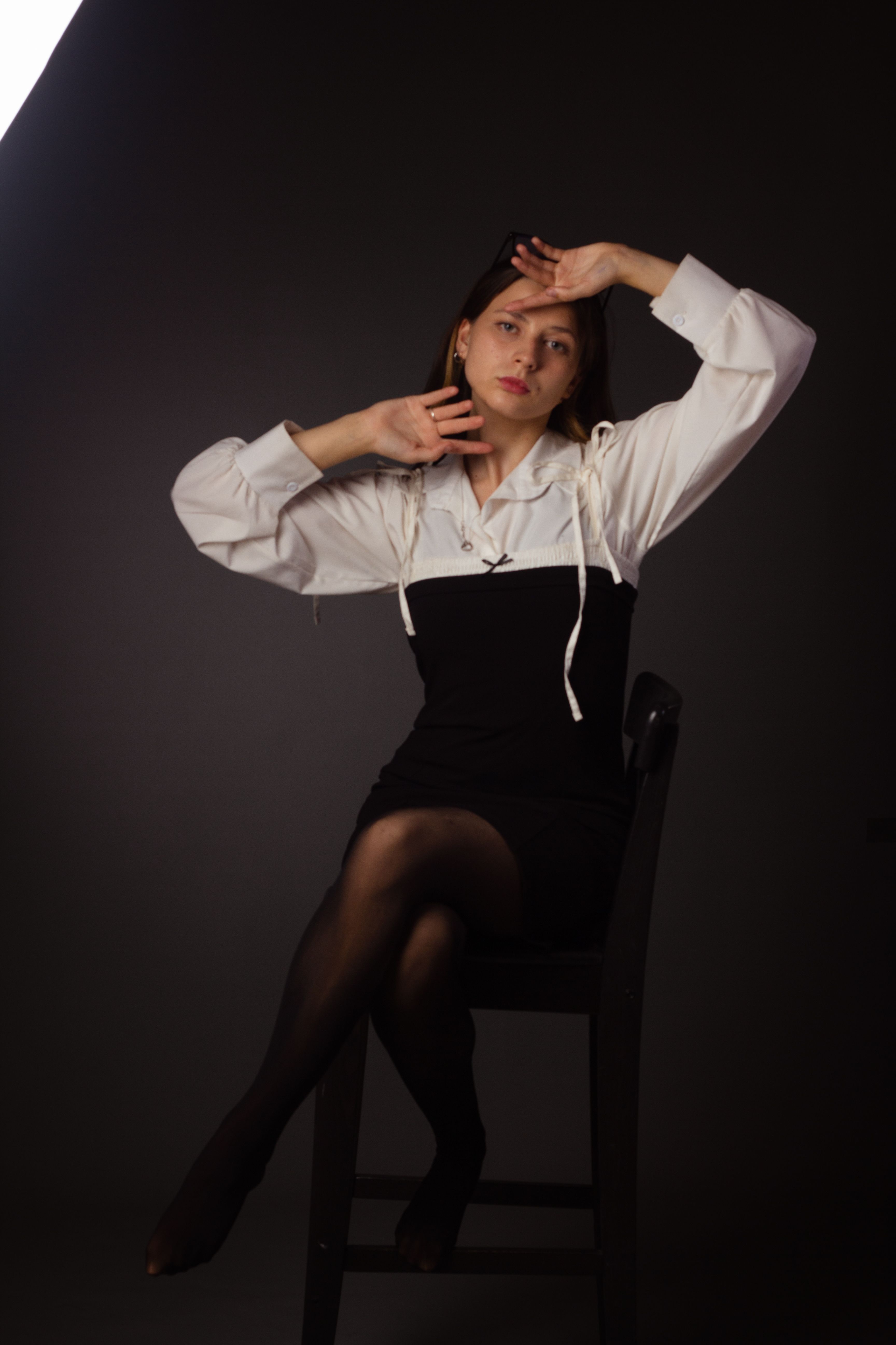 Elegant Woman Posing in Dramatic Lighting · Free Stock Photo