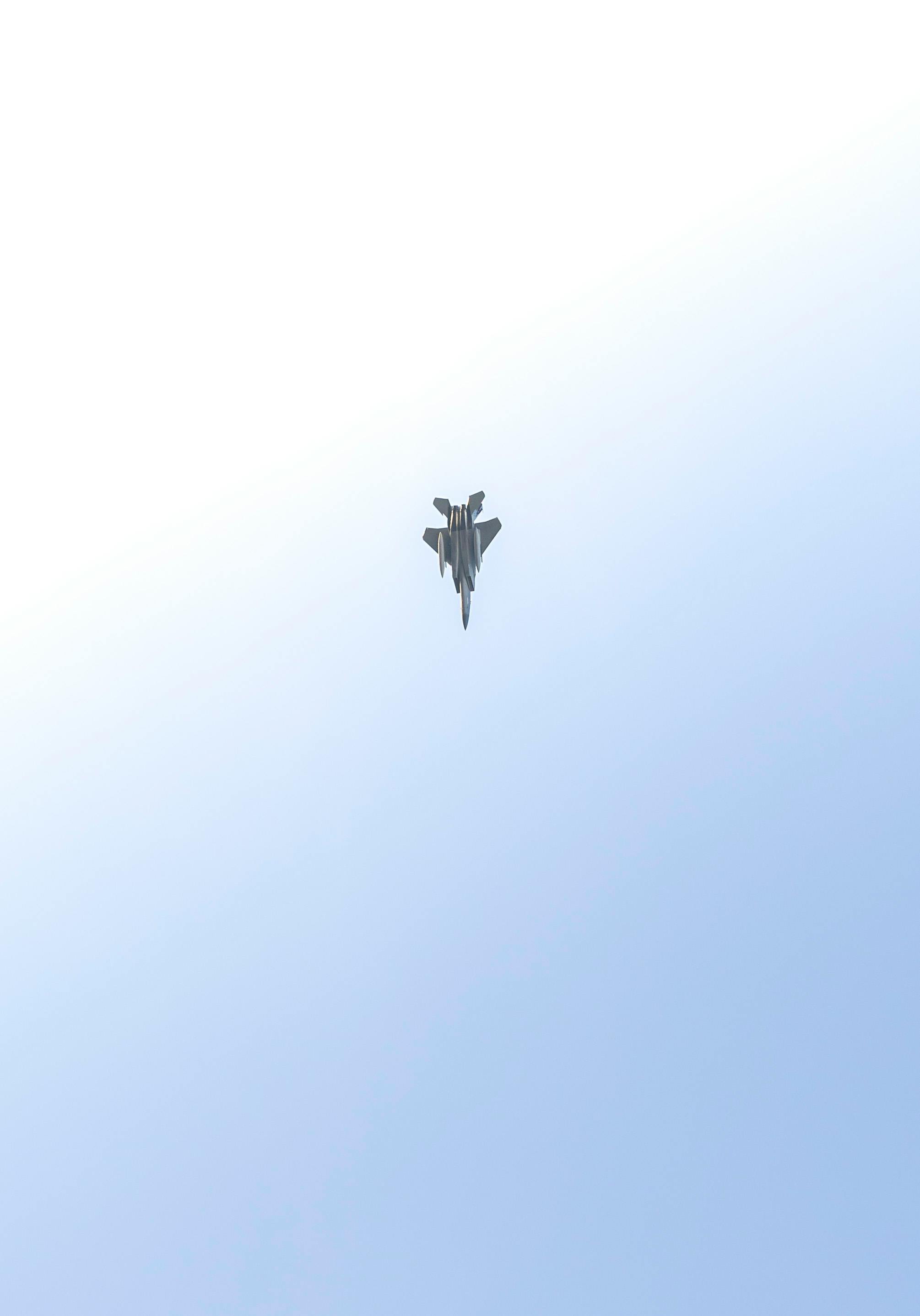 High Altitude Jet Fighter in Clear Blue Sky · Free Stock Photo