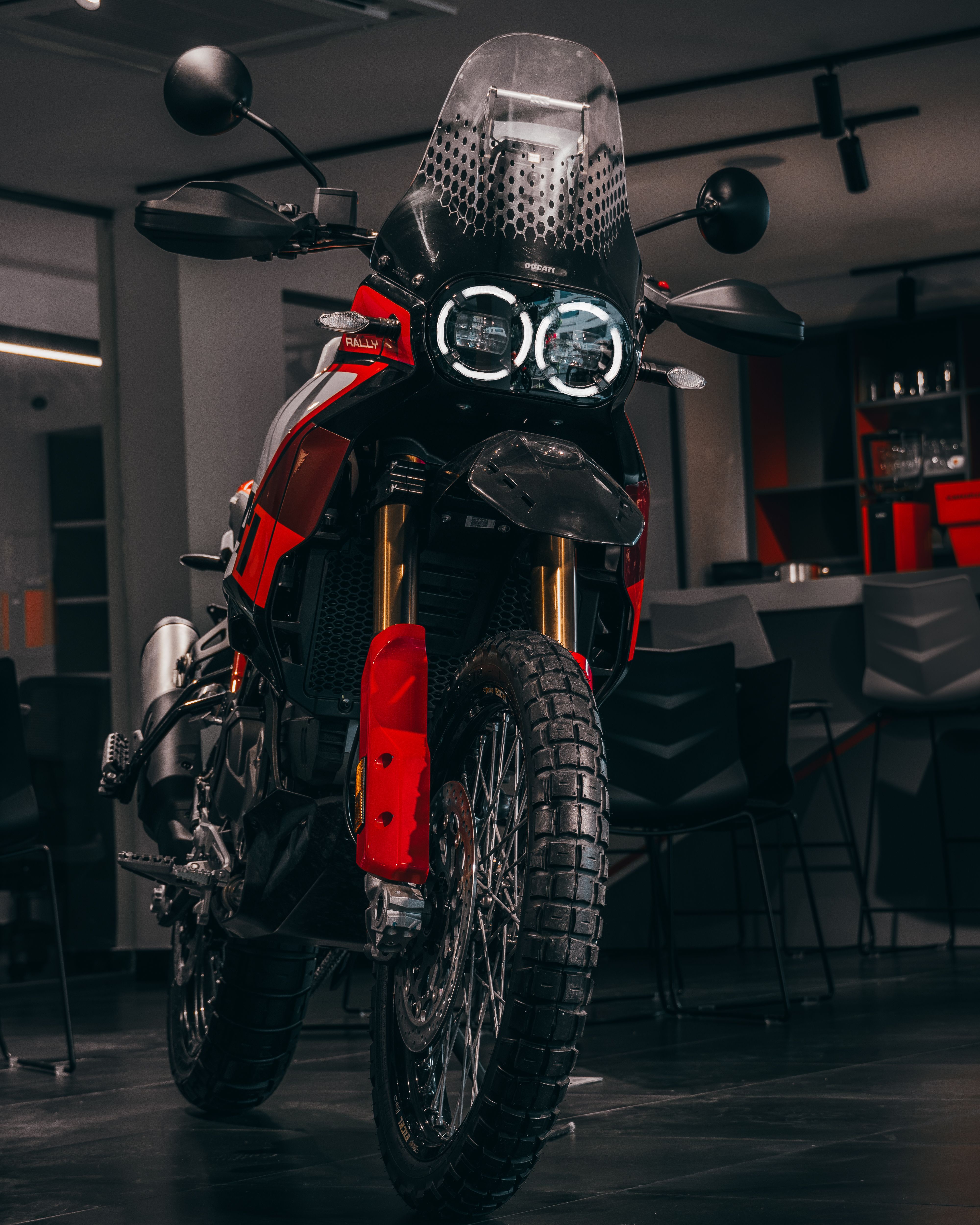 Red Adventure Motorcycle in Showroom Setting · Free Stock Photo