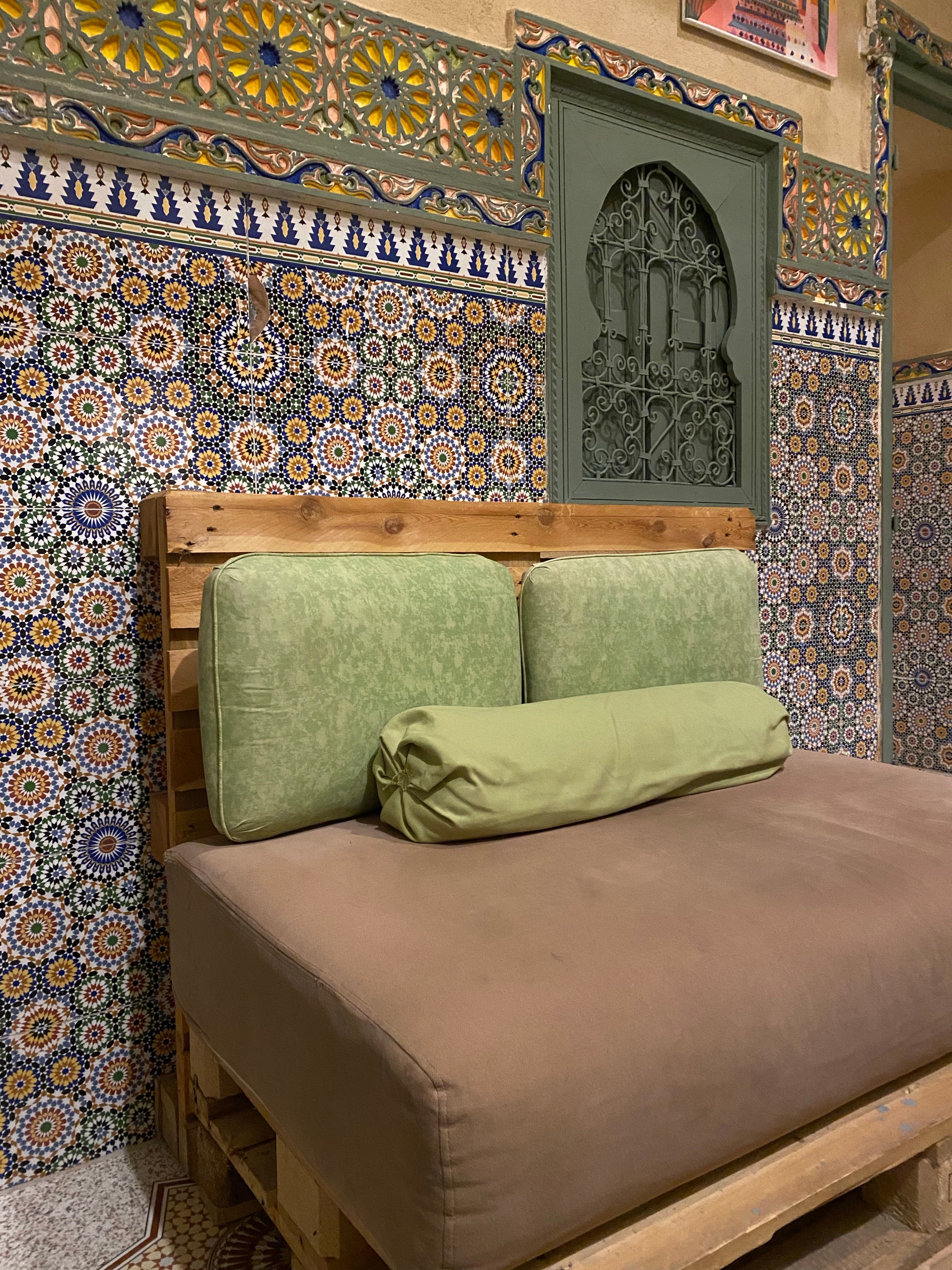 Artistic Moroccan Inspired Wall and Sofa Design · Free Stock Photo