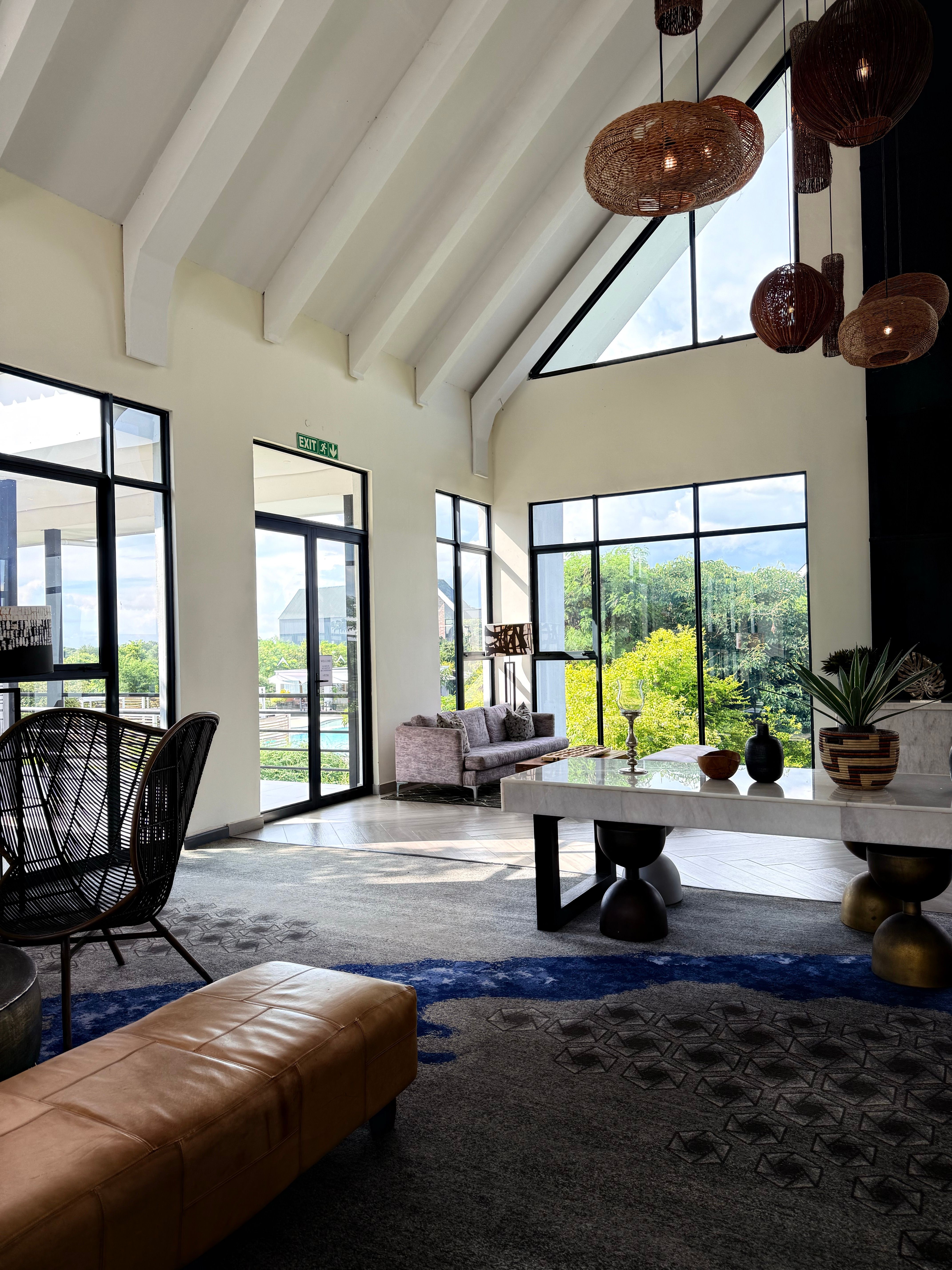 Modern Lounge with Large Windows and Natural Light · Free Stock Photo