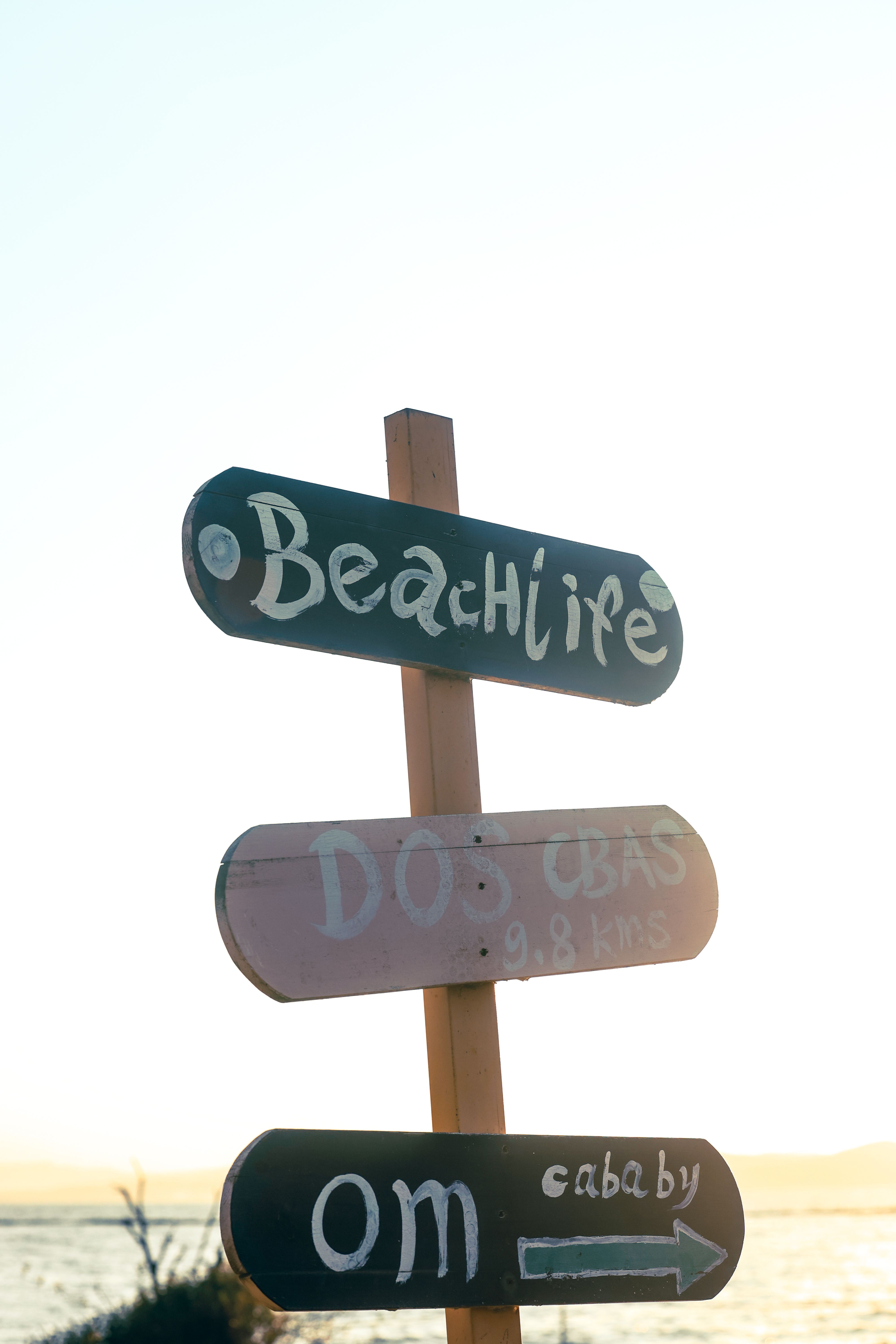 Scenic Beach Directional Signs at Sunset · Free Stock Photo