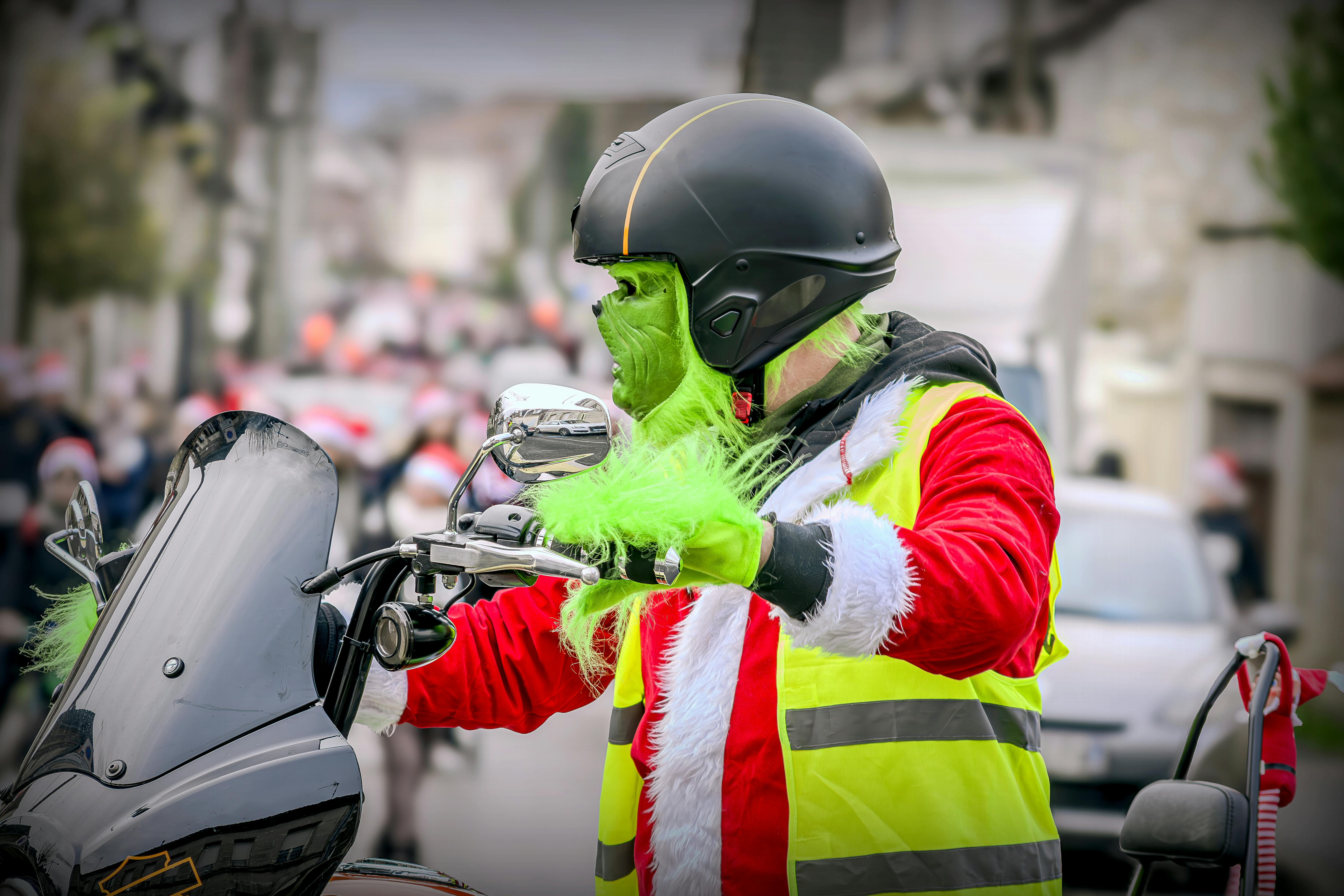 Motorcyclist in Grinch Costume at Christmas Parade · Free Stock Photo