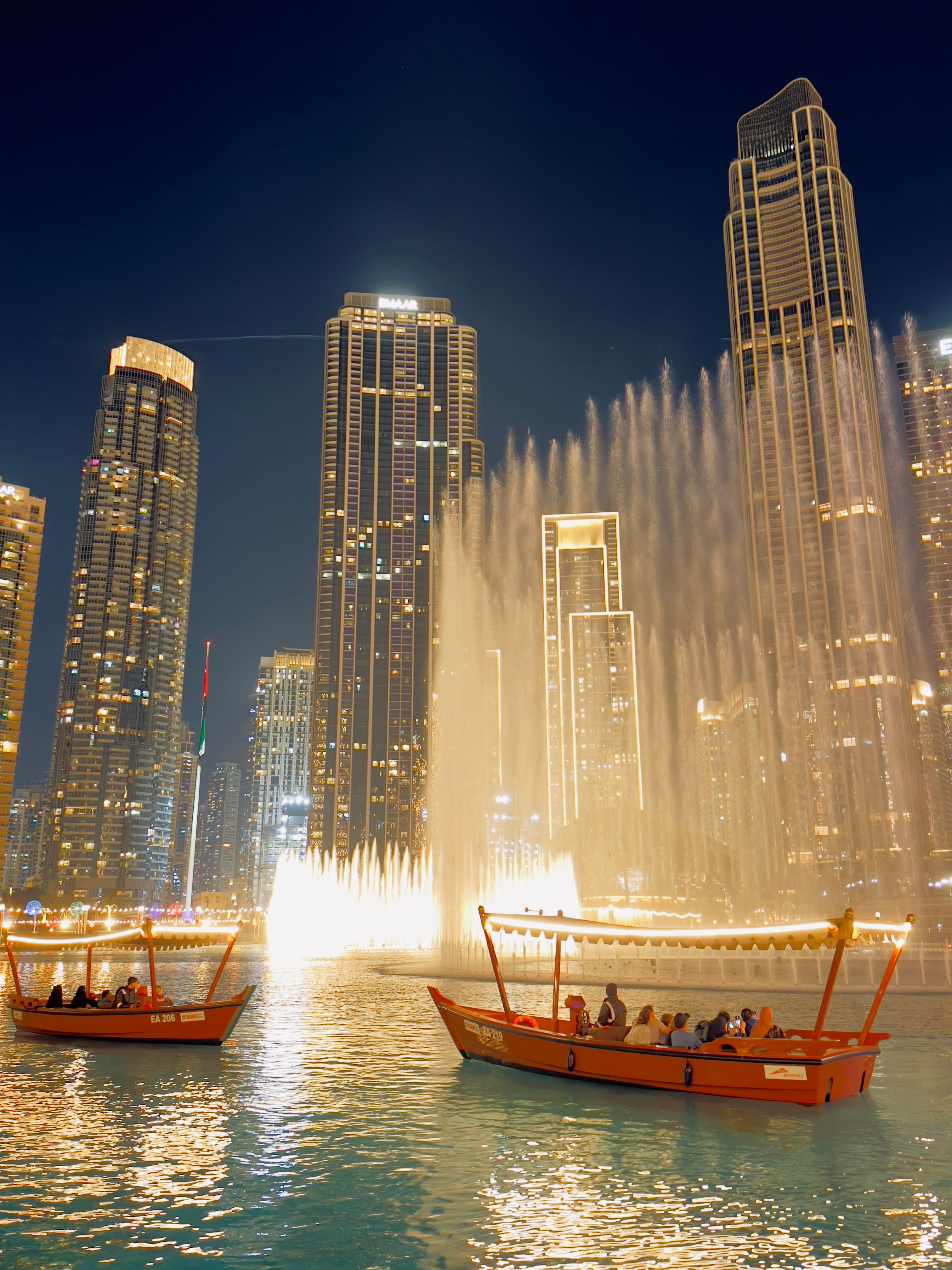 Scenic Night View of Dubai Fountain and Skyscrapers · Free Stock Photo