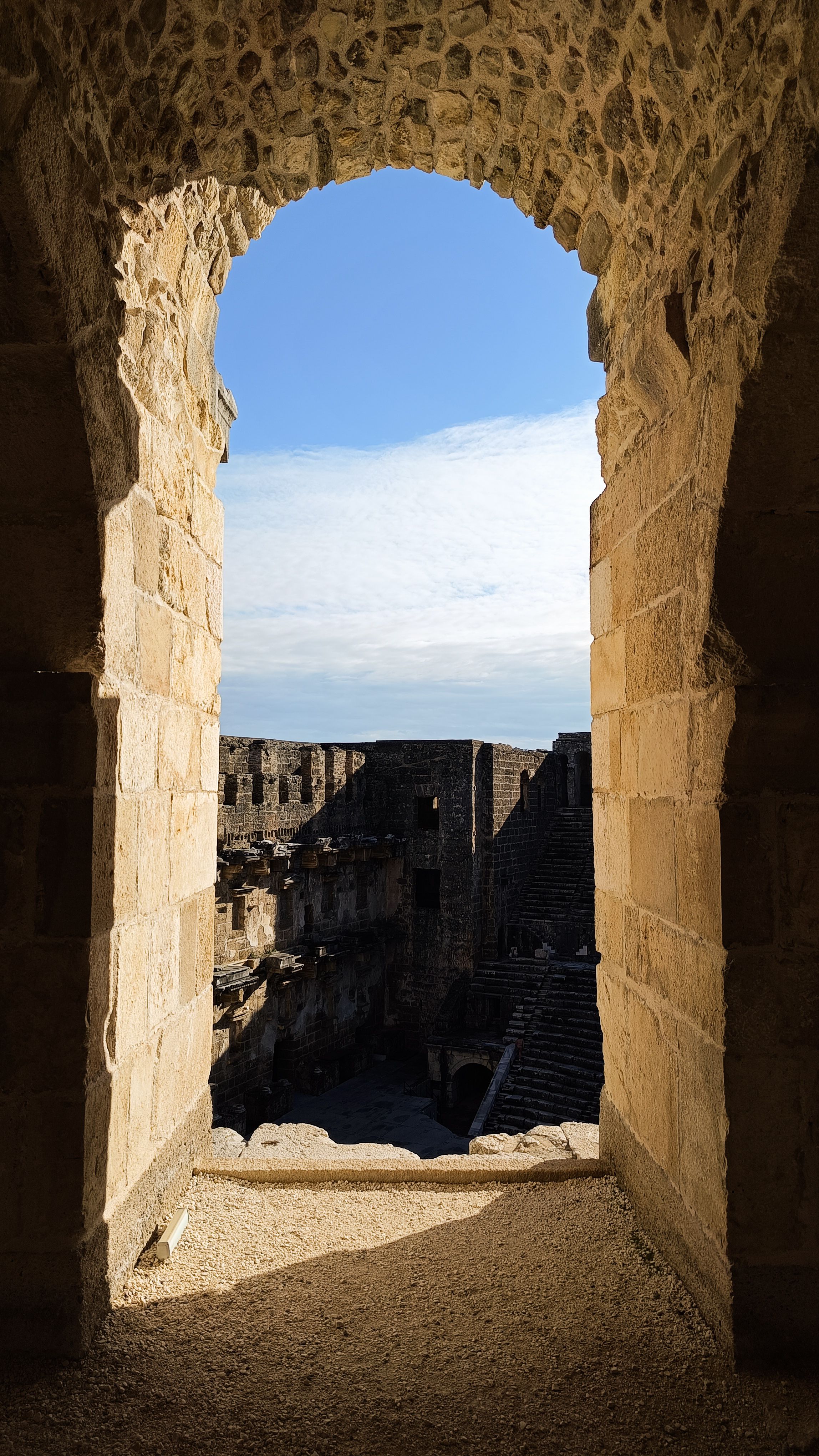 Ancient Stone Archway Overlooking Roman Theater · Free Stock Photo