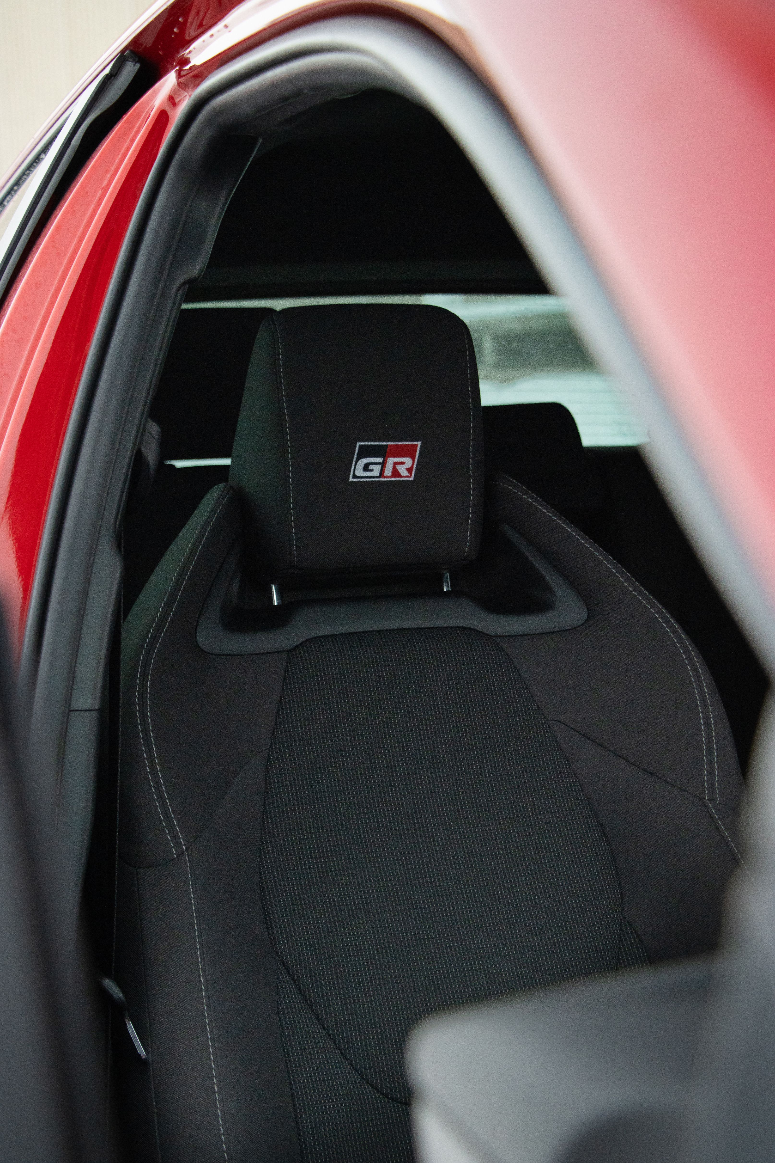 Red Car Interior Featuring GR Racing Seat · Free Stock Photo