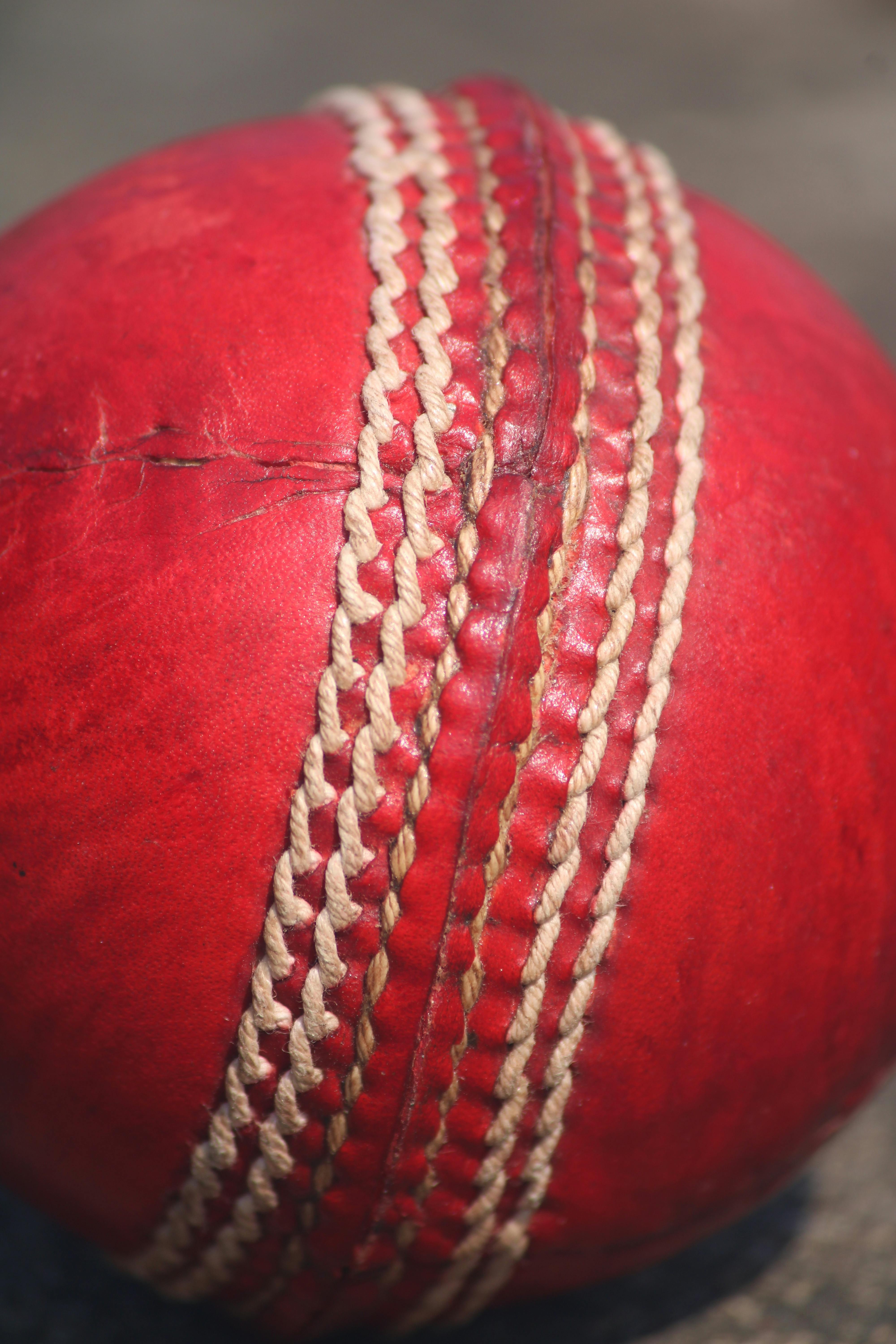 Close-Up of a Red Leather Cricket Ball · Free Stock Photo