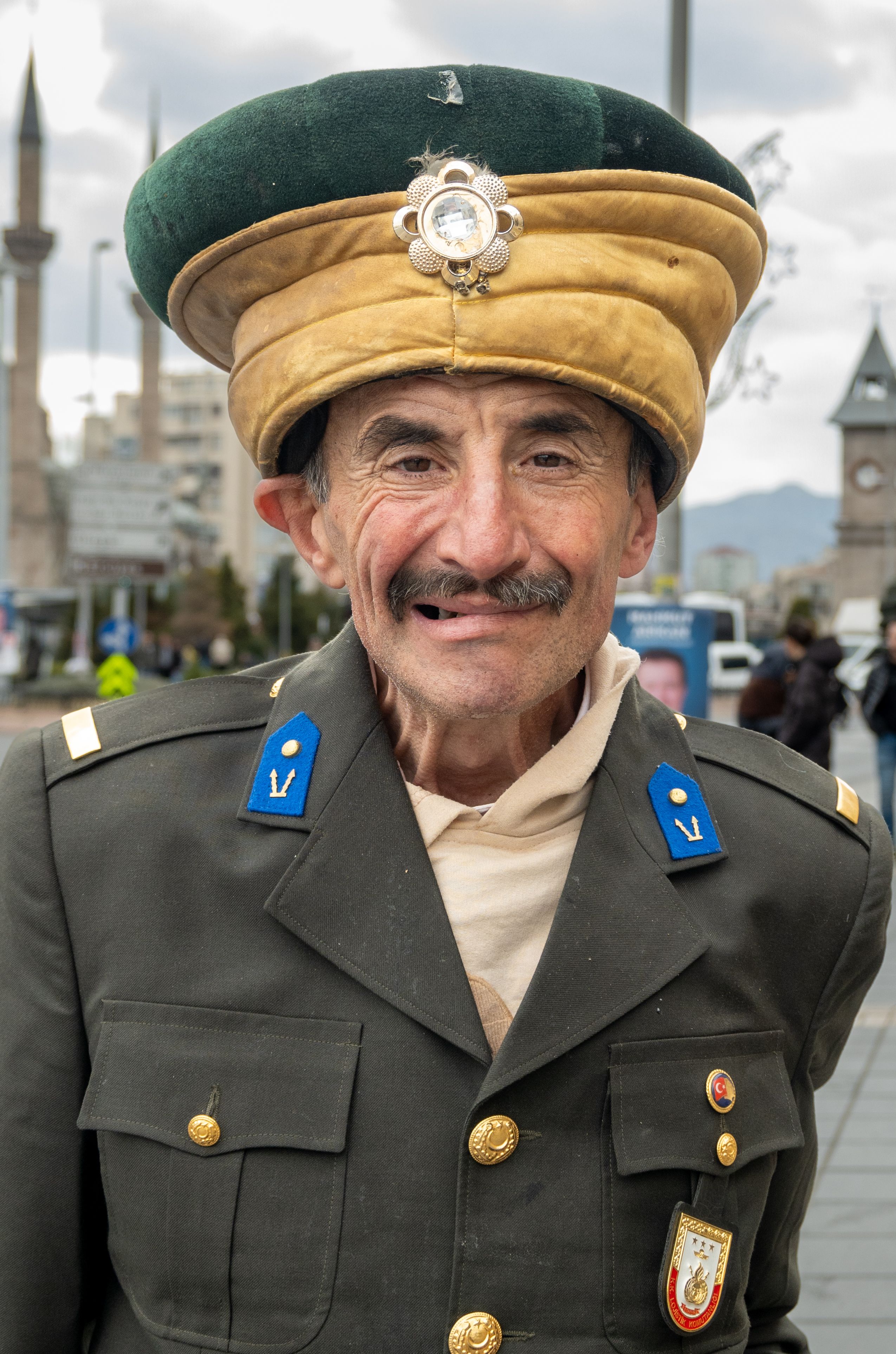 Elderly Man in Military Attire at Urban Landmark · Free Stock Photo