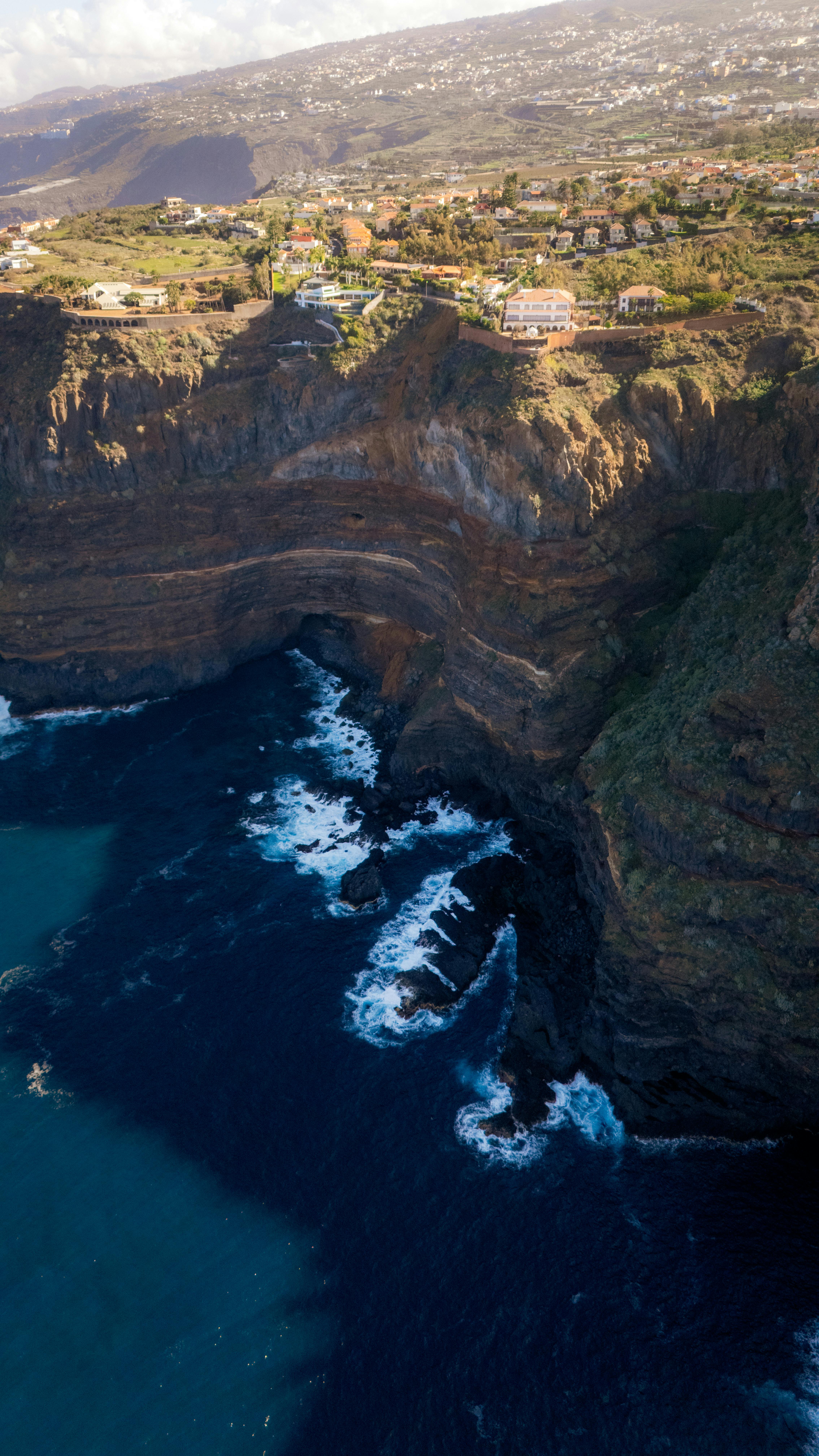 Aerial View of Rugged Coastal Cliffside · Free Stock Photo