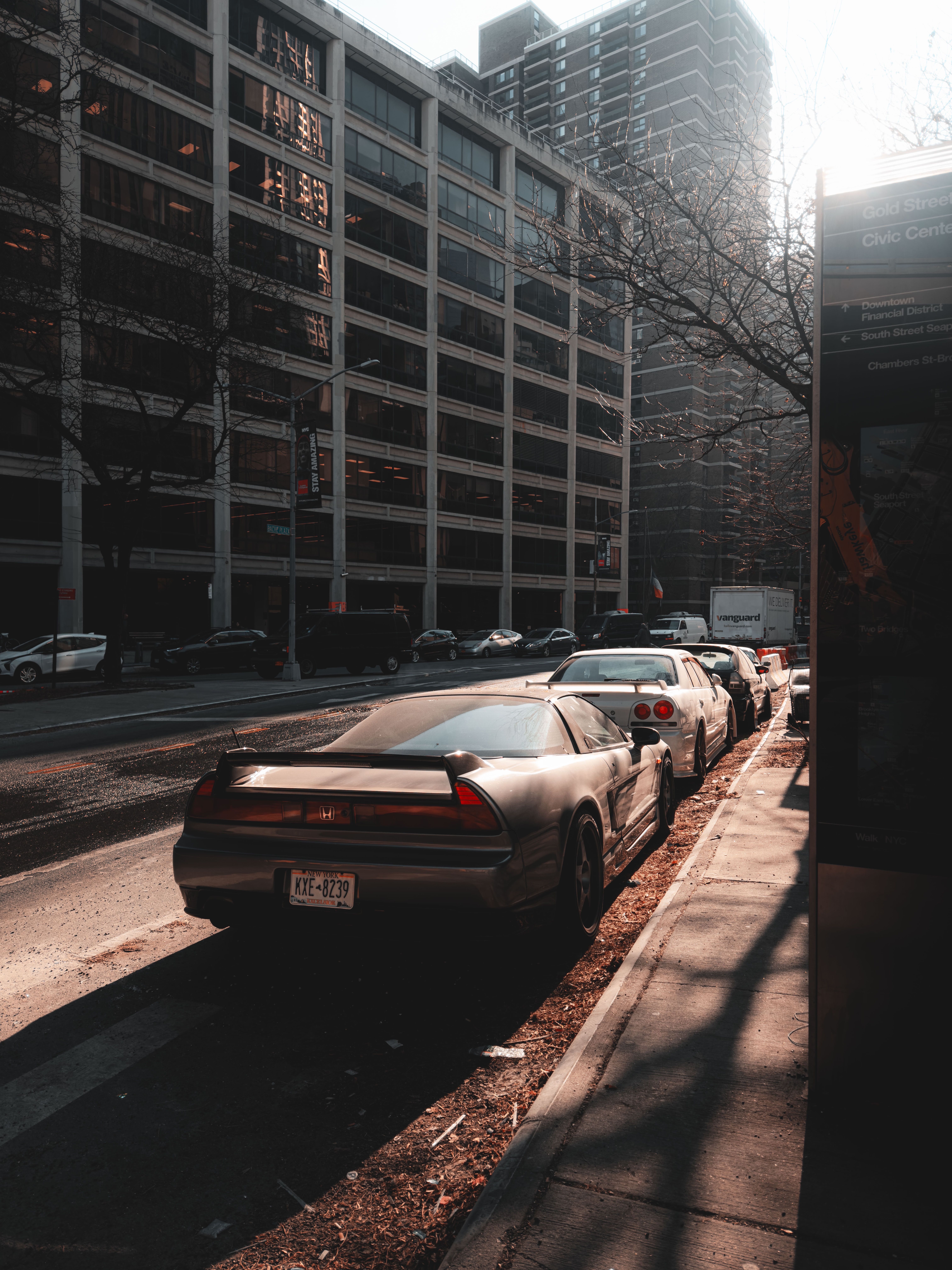 Street View of Urban Downtown with Parked Cars · Free Stock Photo