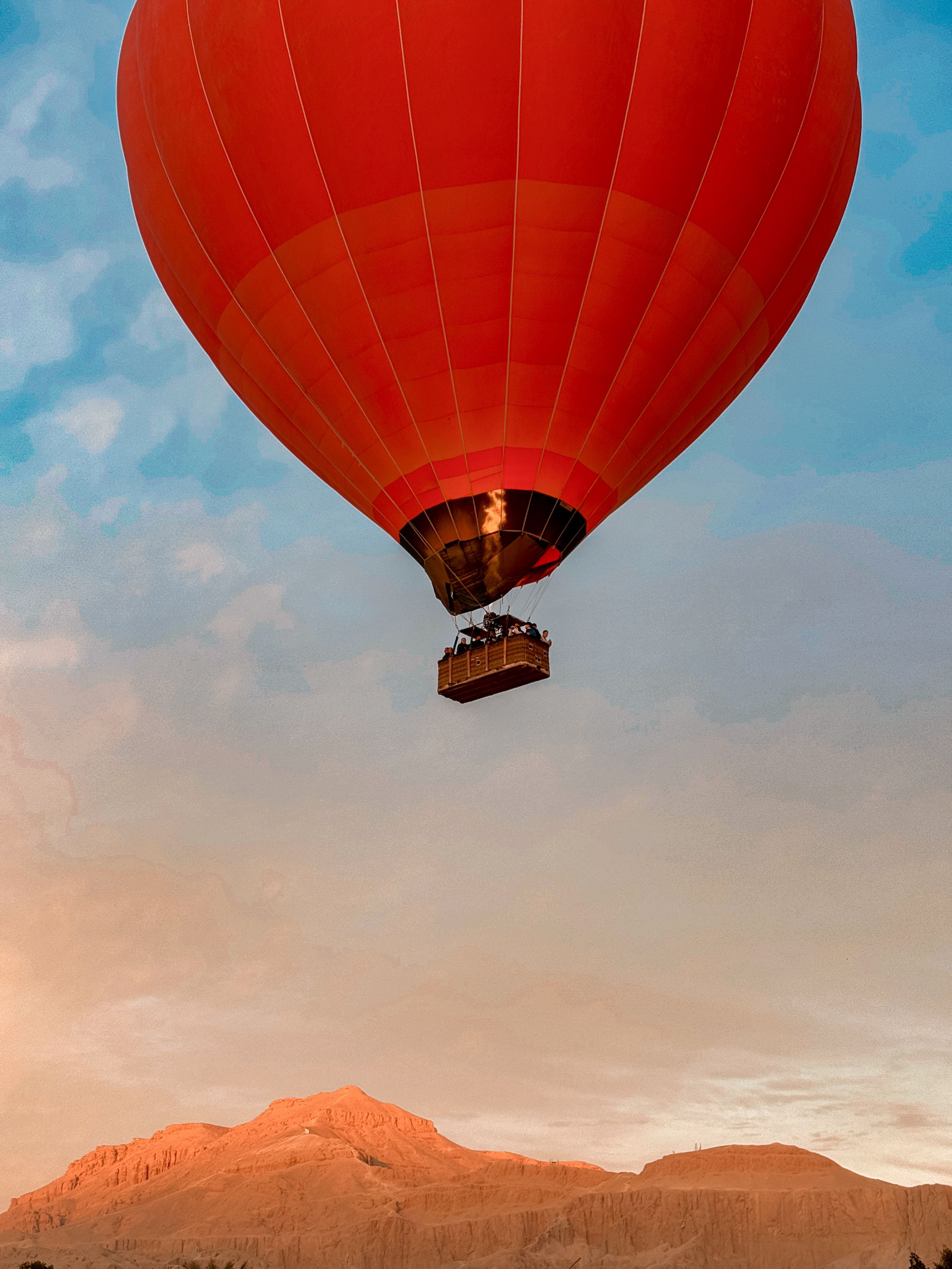 Hot Air Balloon Soaring Over Luxor at Sunrise · Free Stock Photo