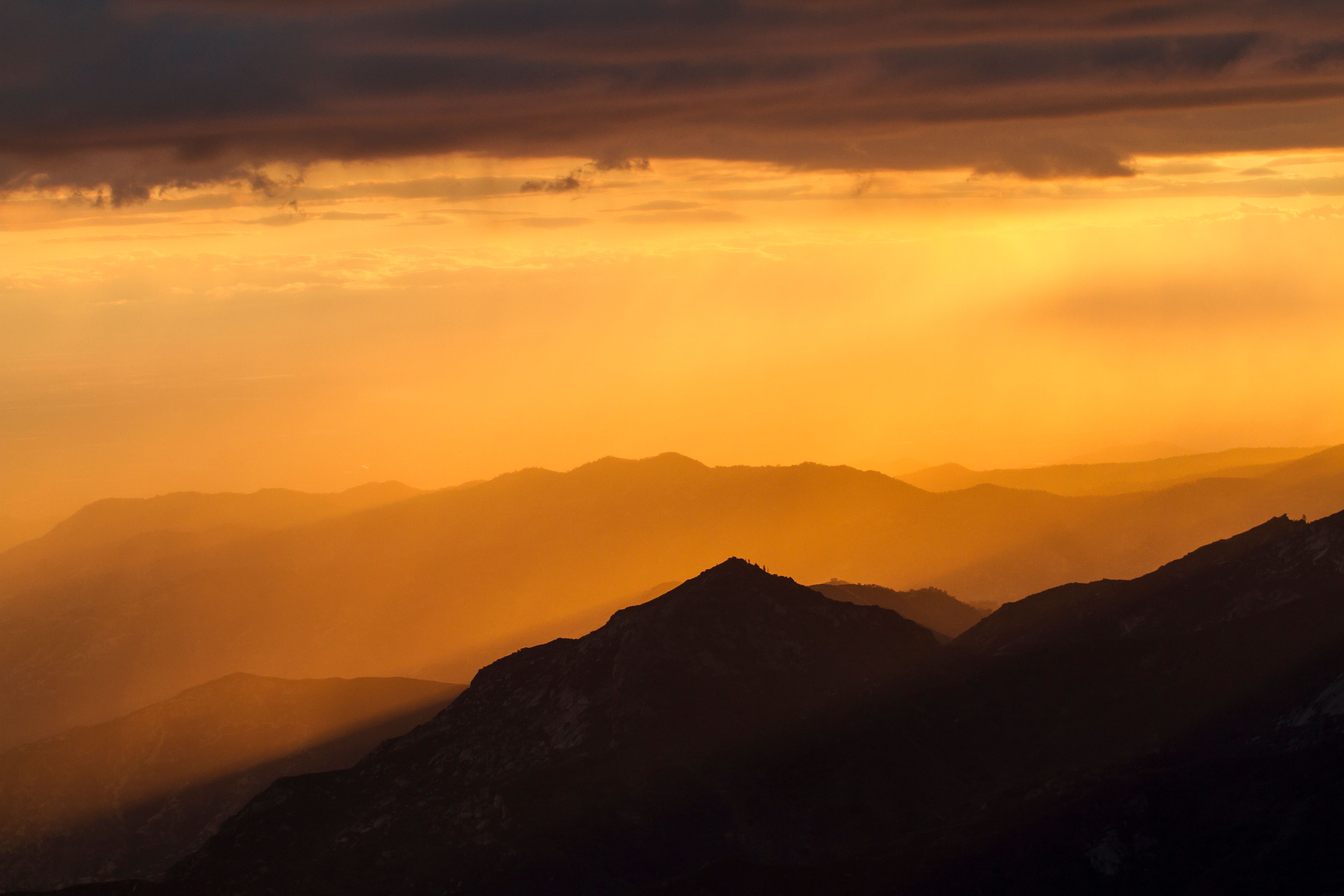 Golden Sunset Over Mountain Ranges · Free Stock Photo
