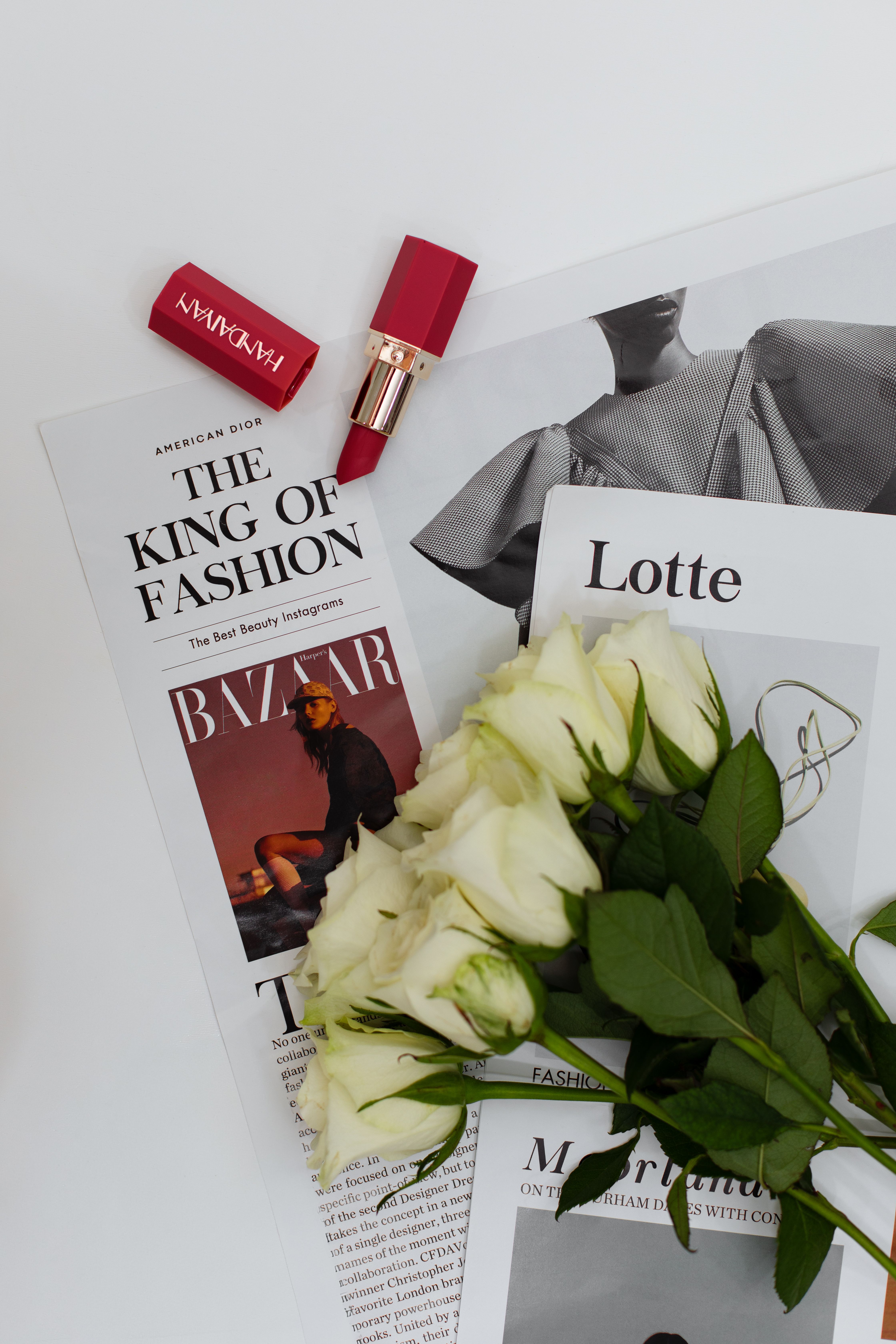 Elegant Flat Lay of Fashion Magazine with Roses · Free Stock Photo