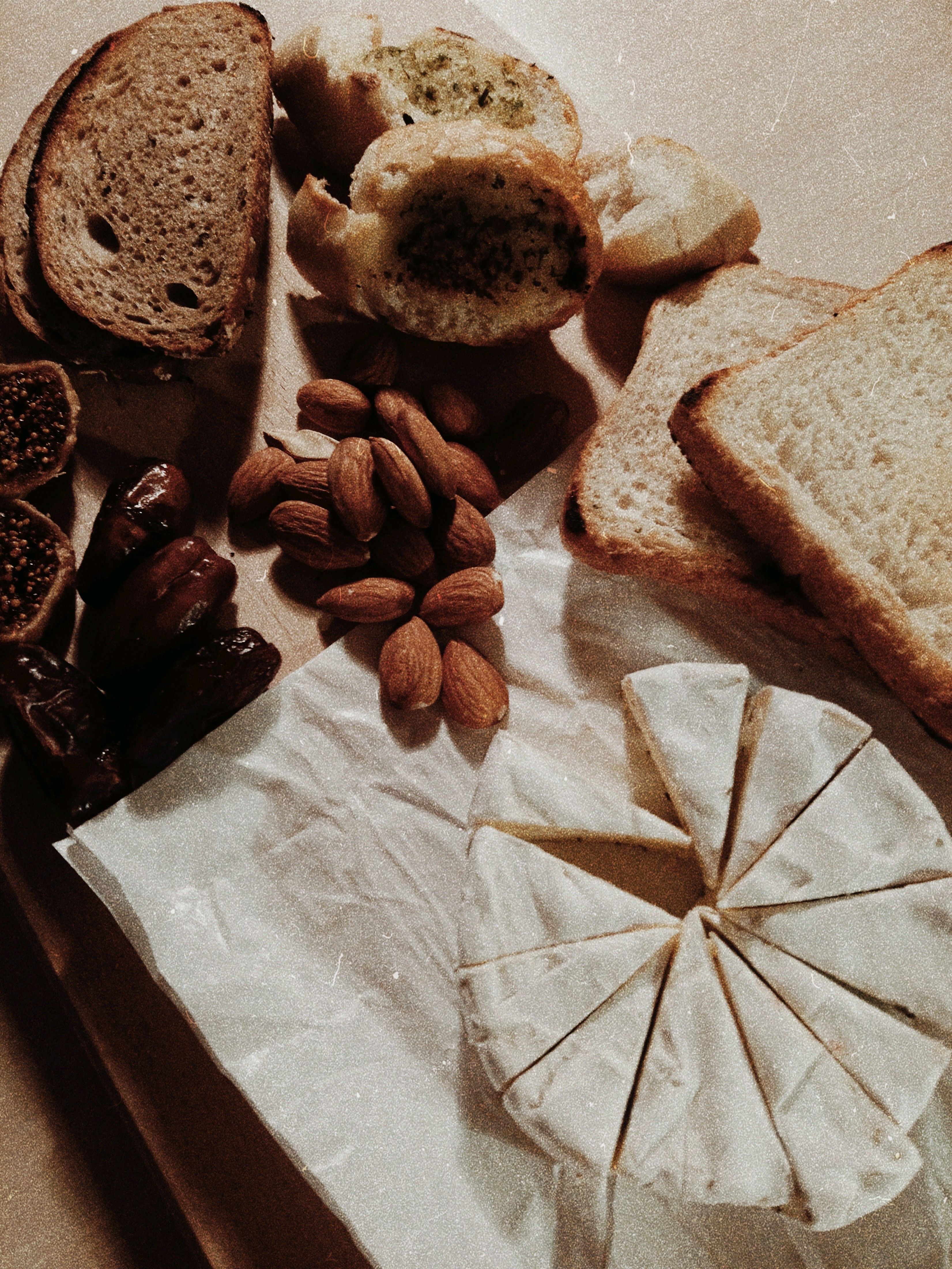 Rustic Cheese and Bread Platter with Nuts · Free Stock Photo