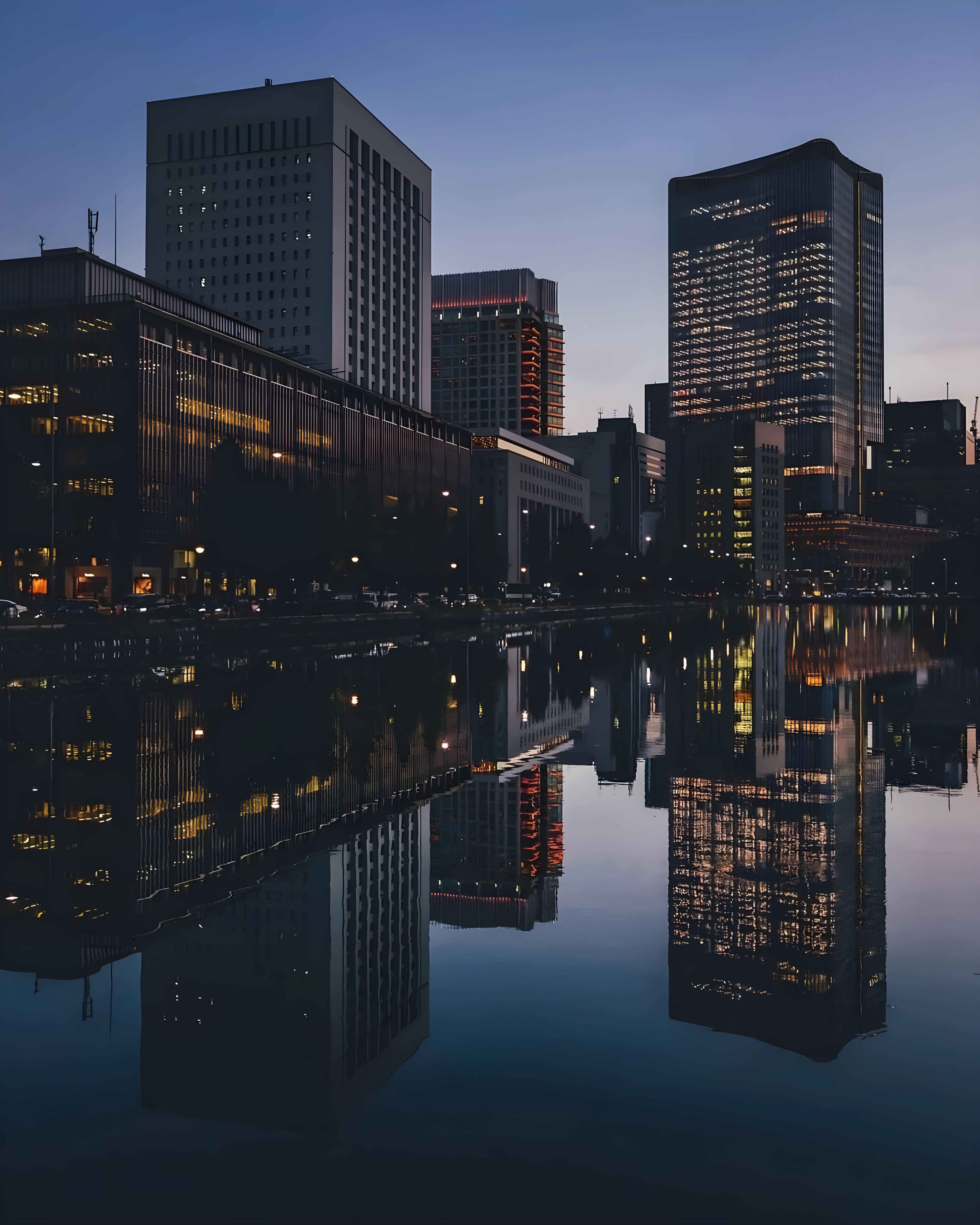 Cityscape at Dusk with Reflections · Free Stock Photo