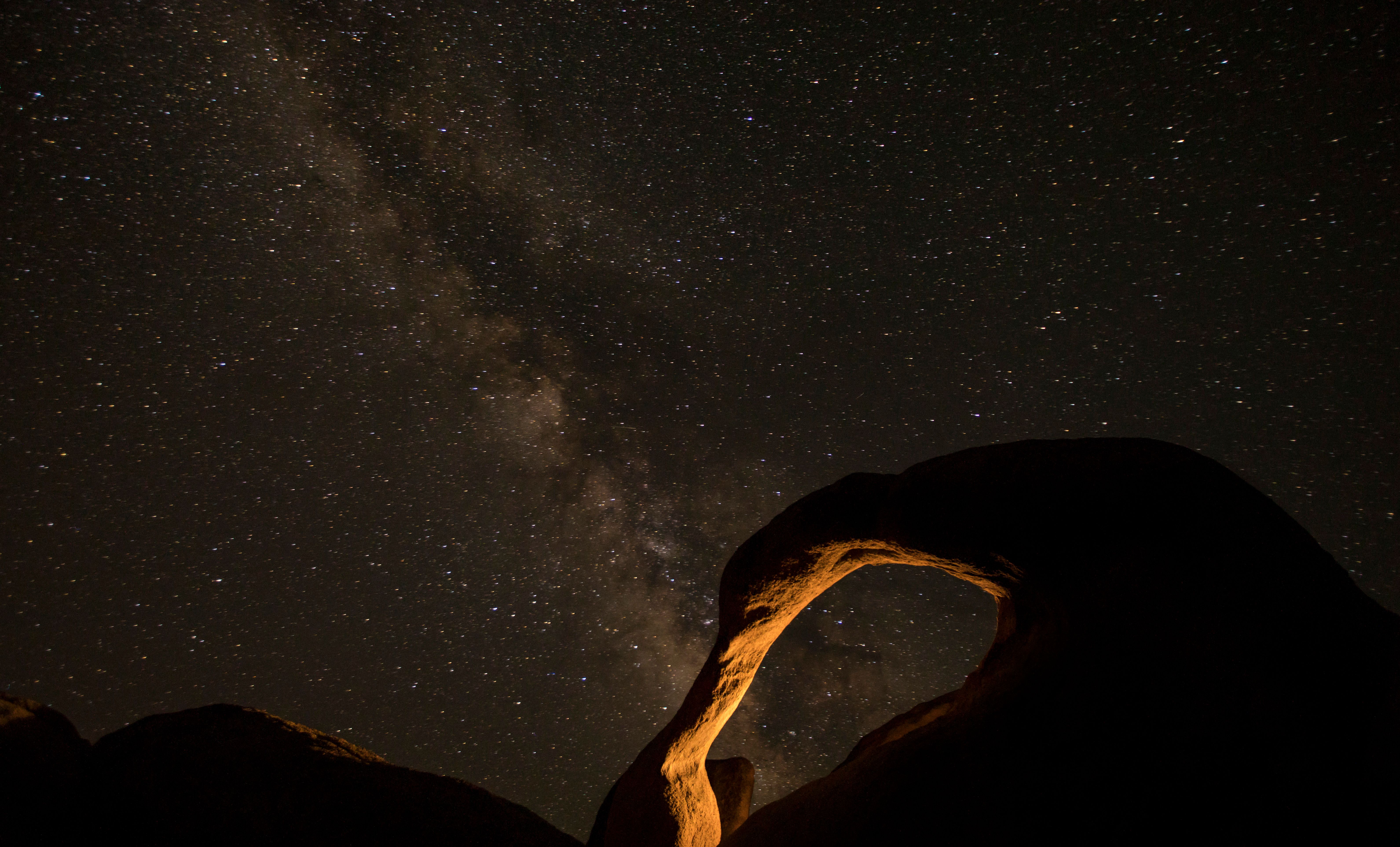 Starry Night Sky Over Natural Rock Arch · Free Stock Photo