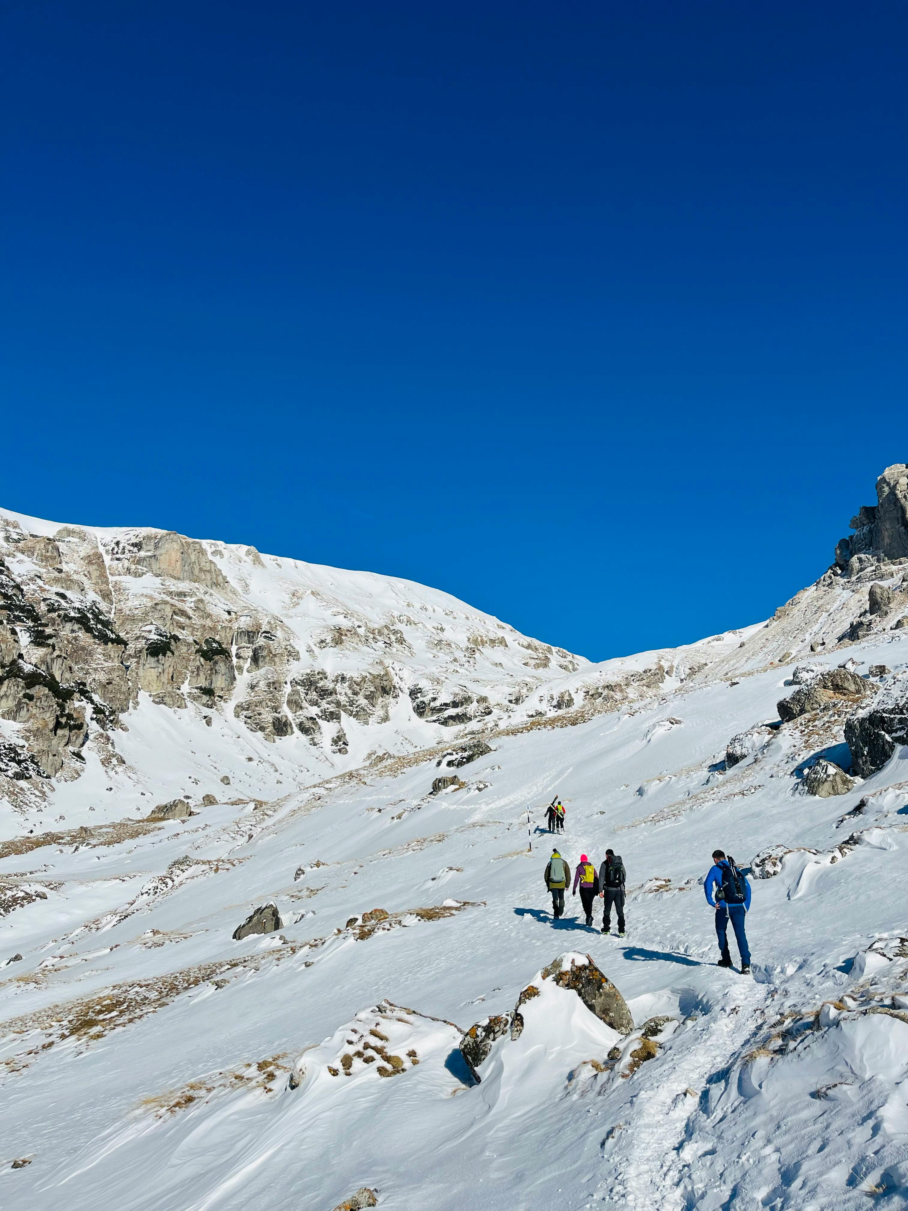 Hiking Adventure in Snowy Mountain Terrain · Free Stock Photo