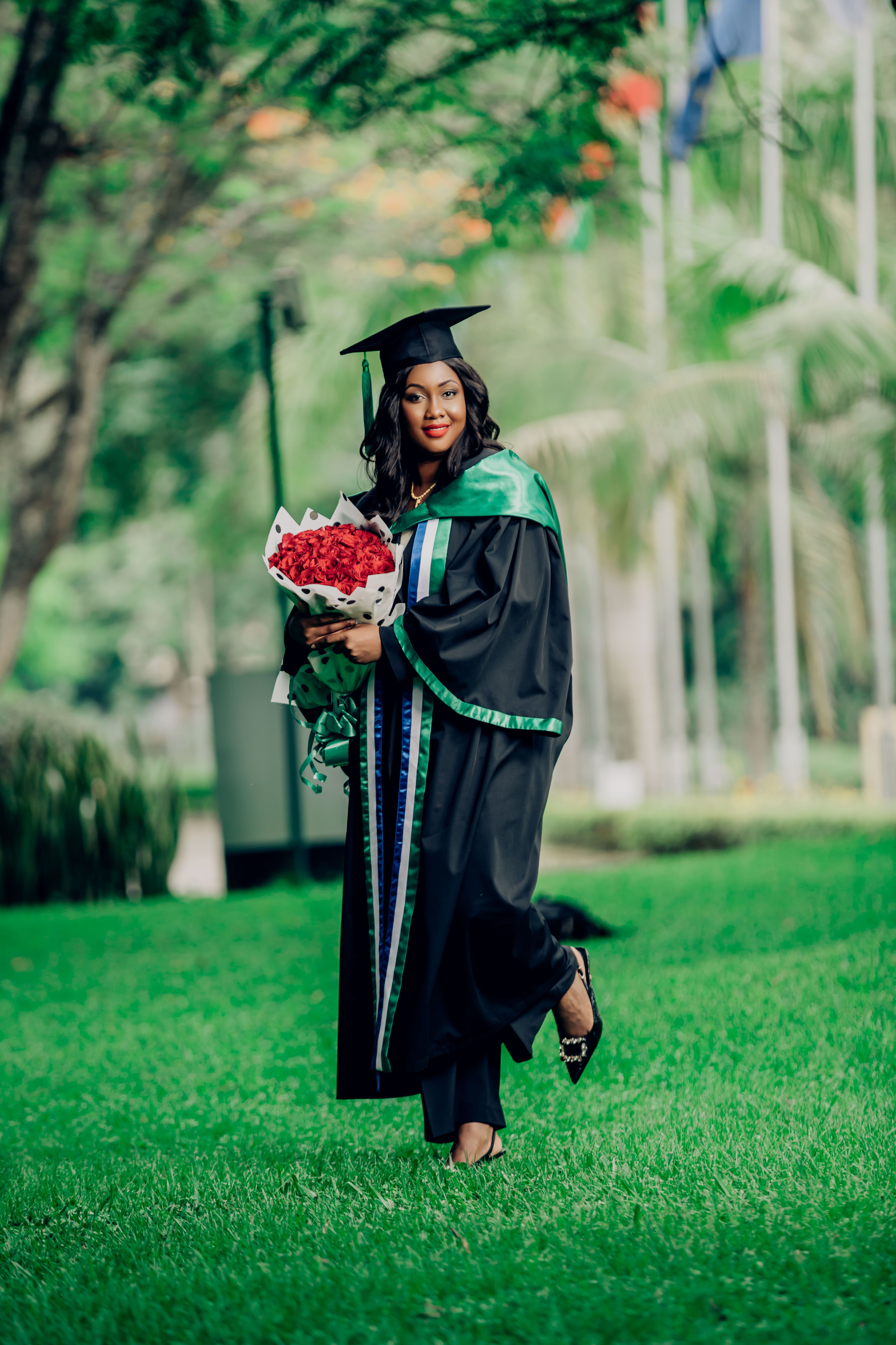 Graduation Day Celebration with Bouquet of Roses · Free Stock Photo