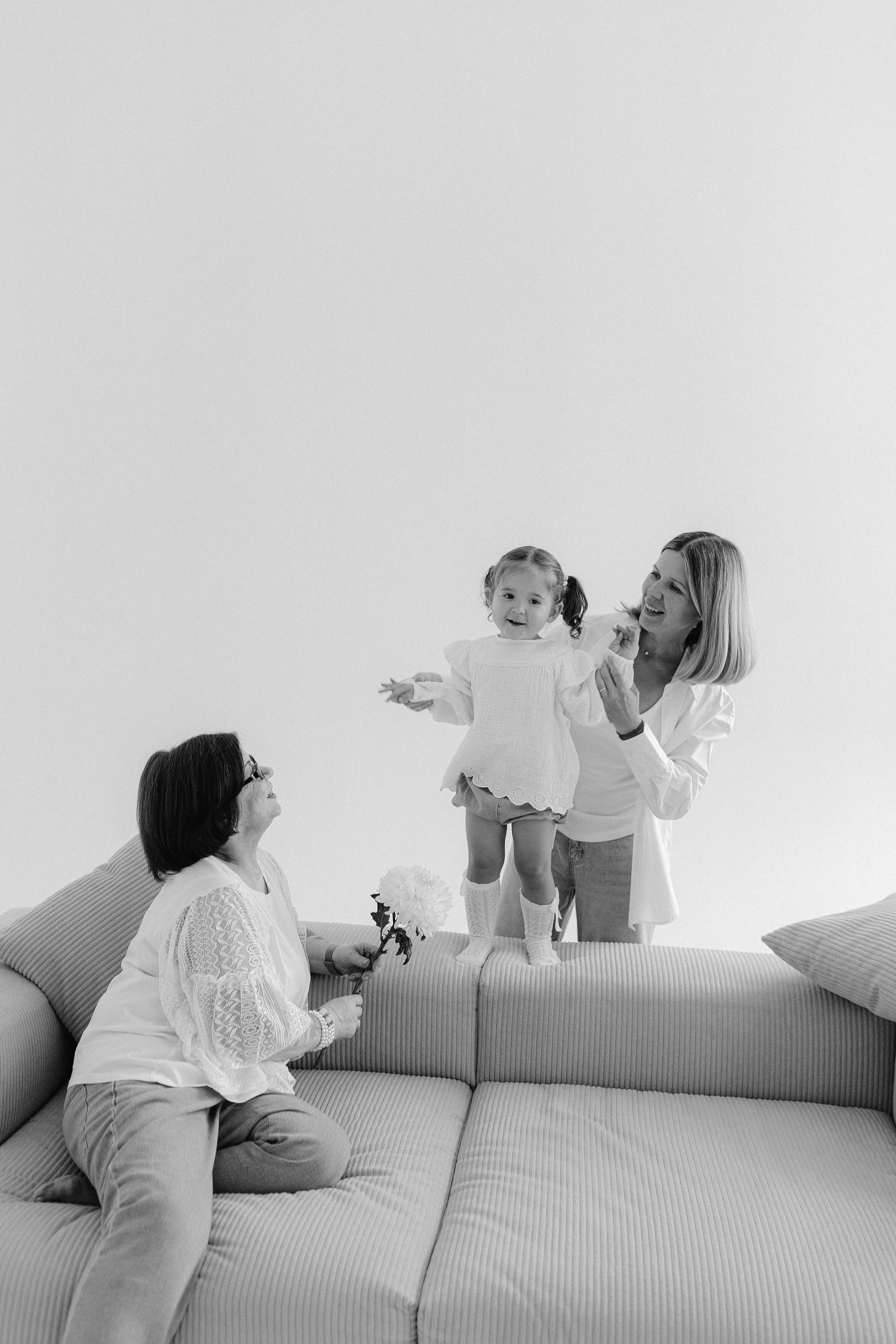Three Generations Bonding in Cozy Living Room · Free Stock Photo