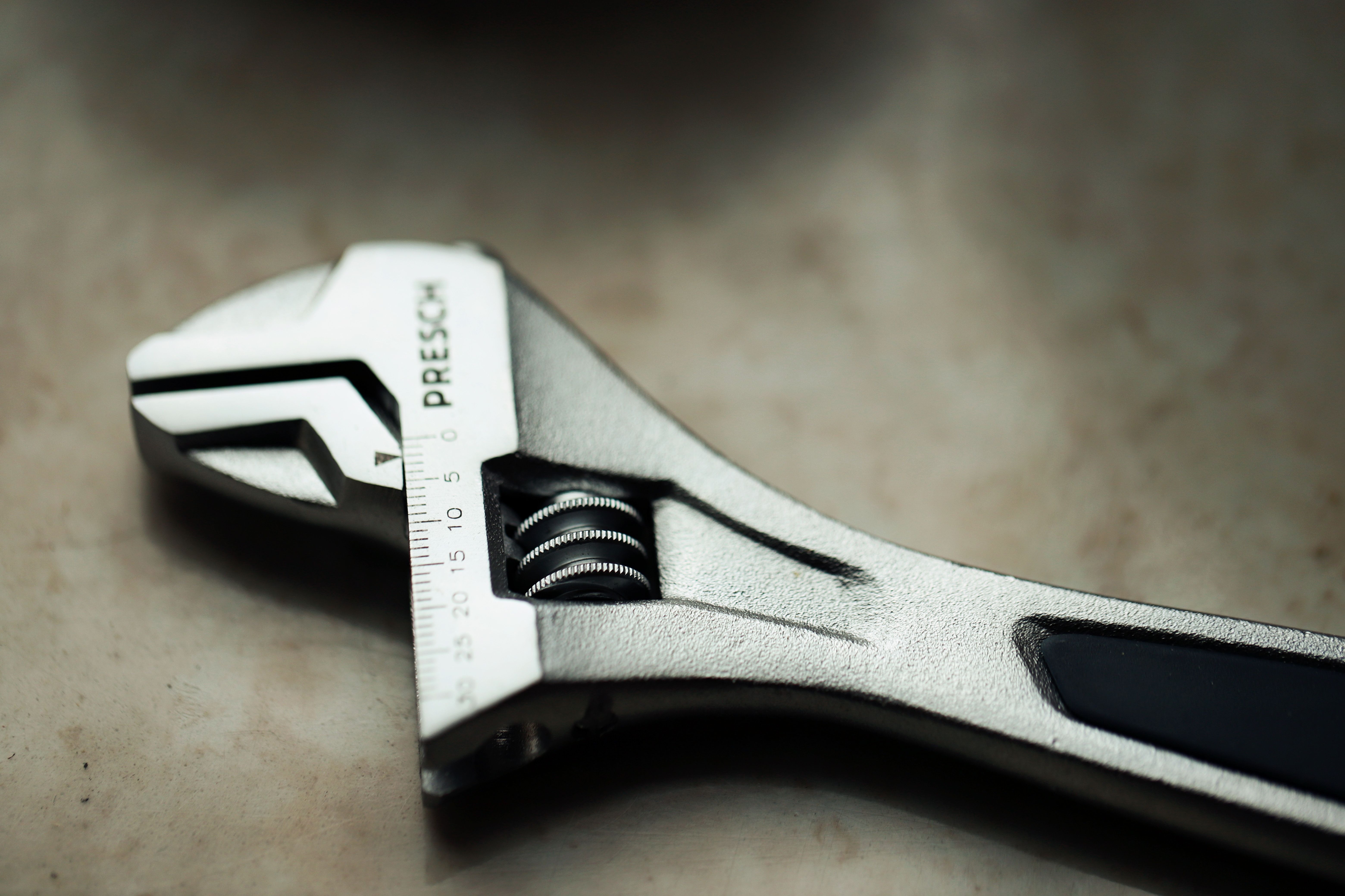 Close-Up of an Adjustable Wrench on a Surface · Free Stock Photo