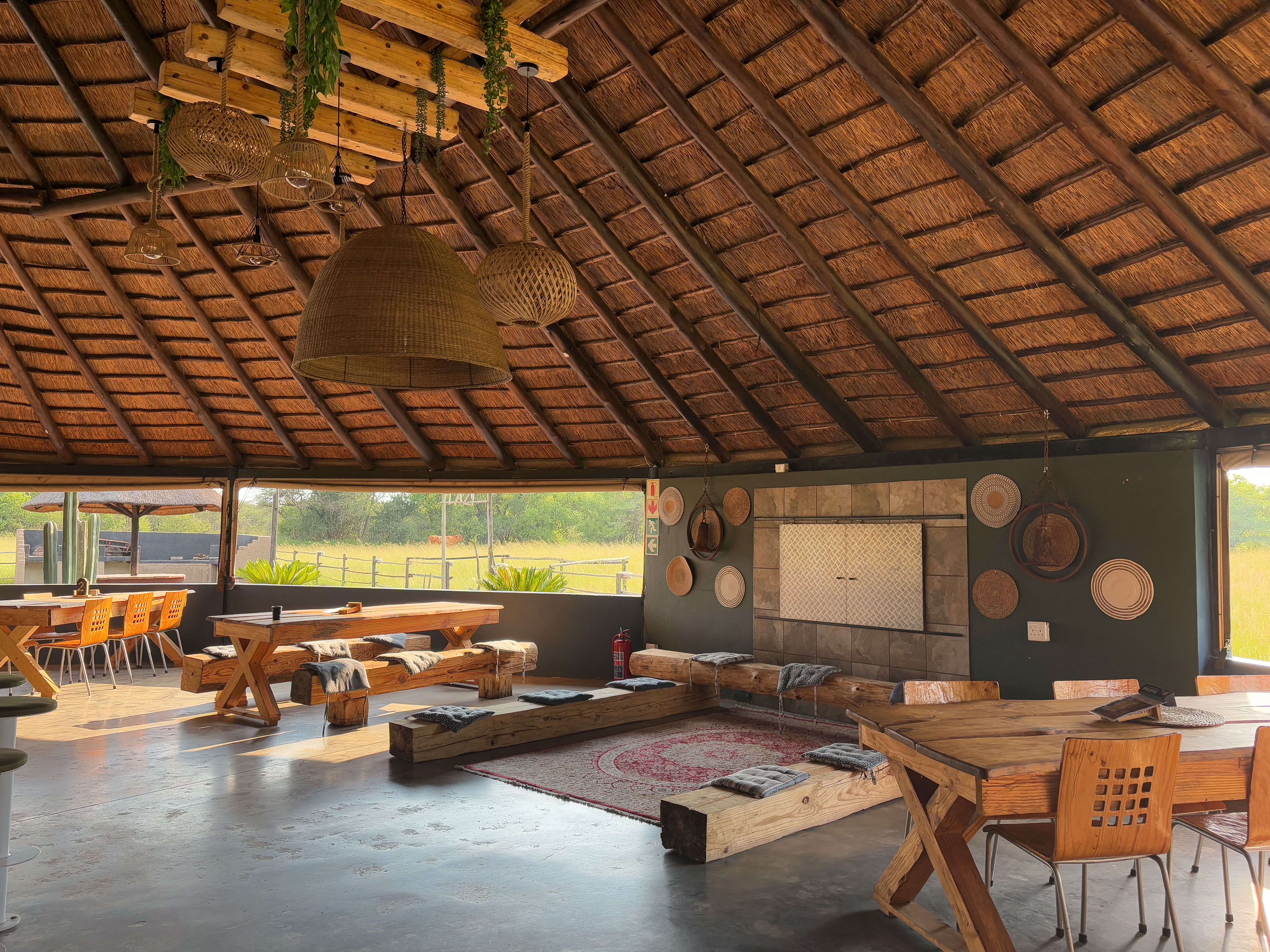 Rustic Open-Air Thatched Roof Restaurant Interior · Free Stock Photo